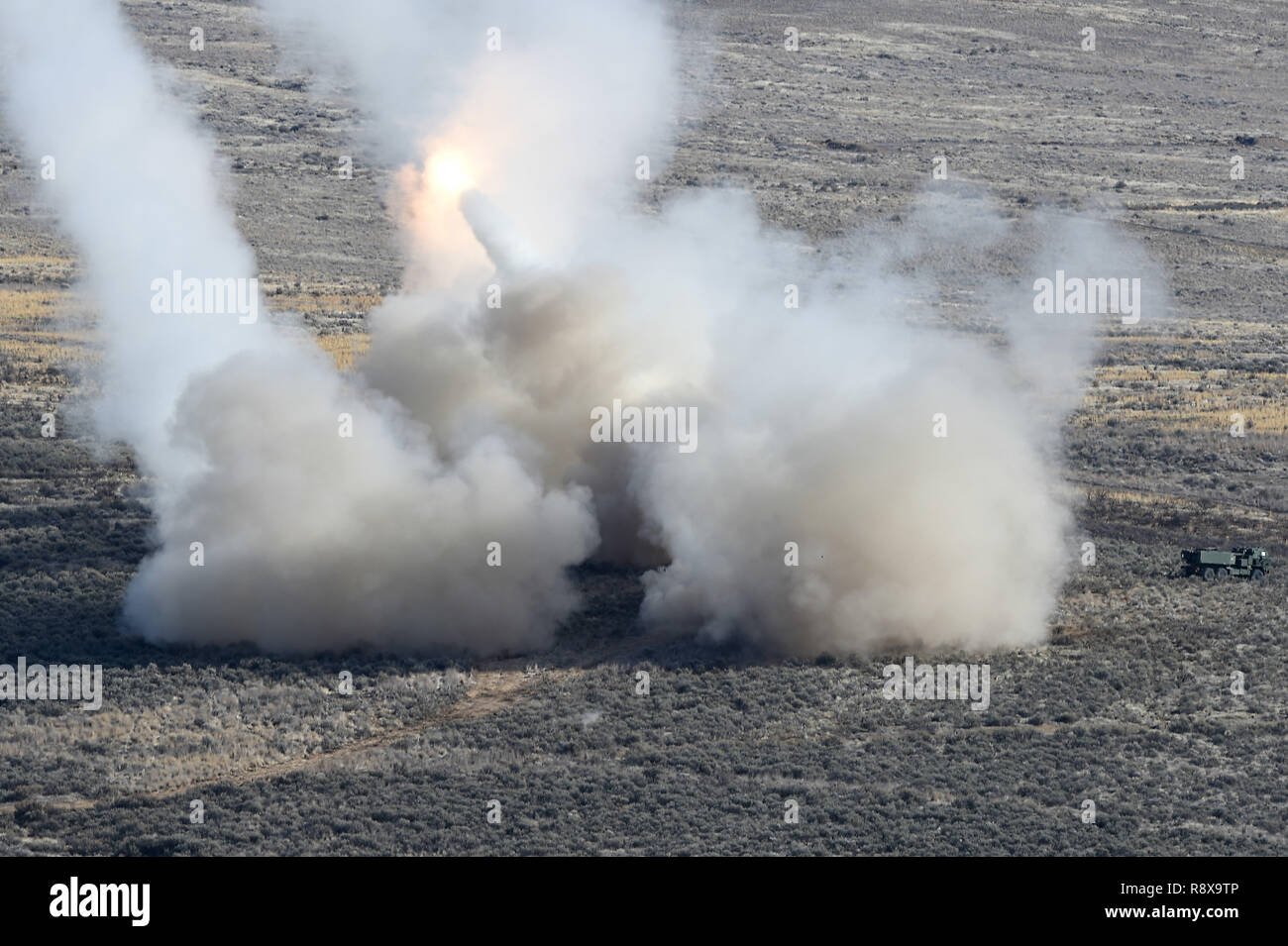 Four U.S. Army High Mobility Artillery Rocket System vehicles (HIMARS ...