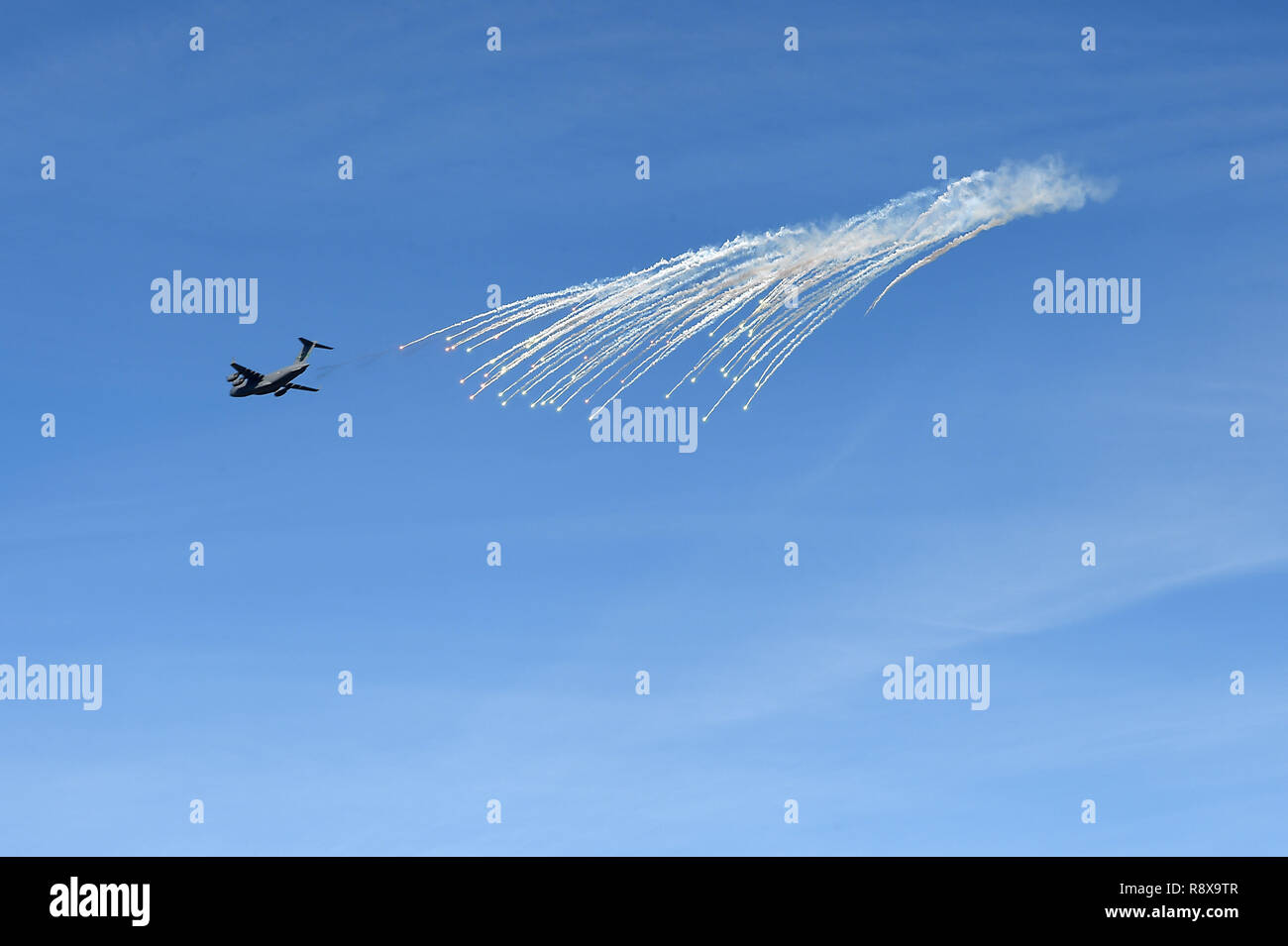 A McChord C-17 Globemaster III releases flares over the Selah airstrip ...