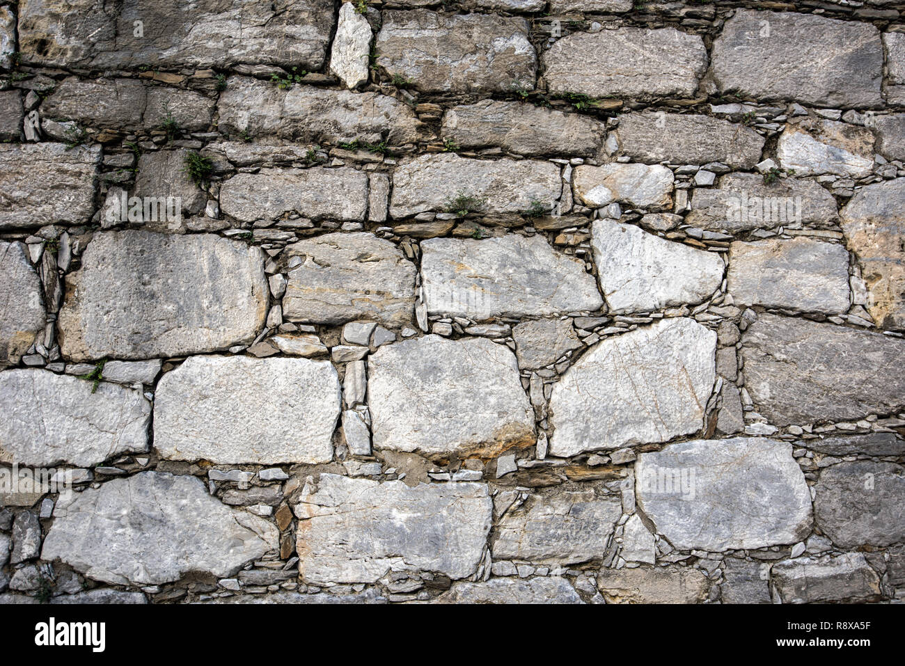 Old stone wall of irregular stones in old Europe Stock Photo - Alamy