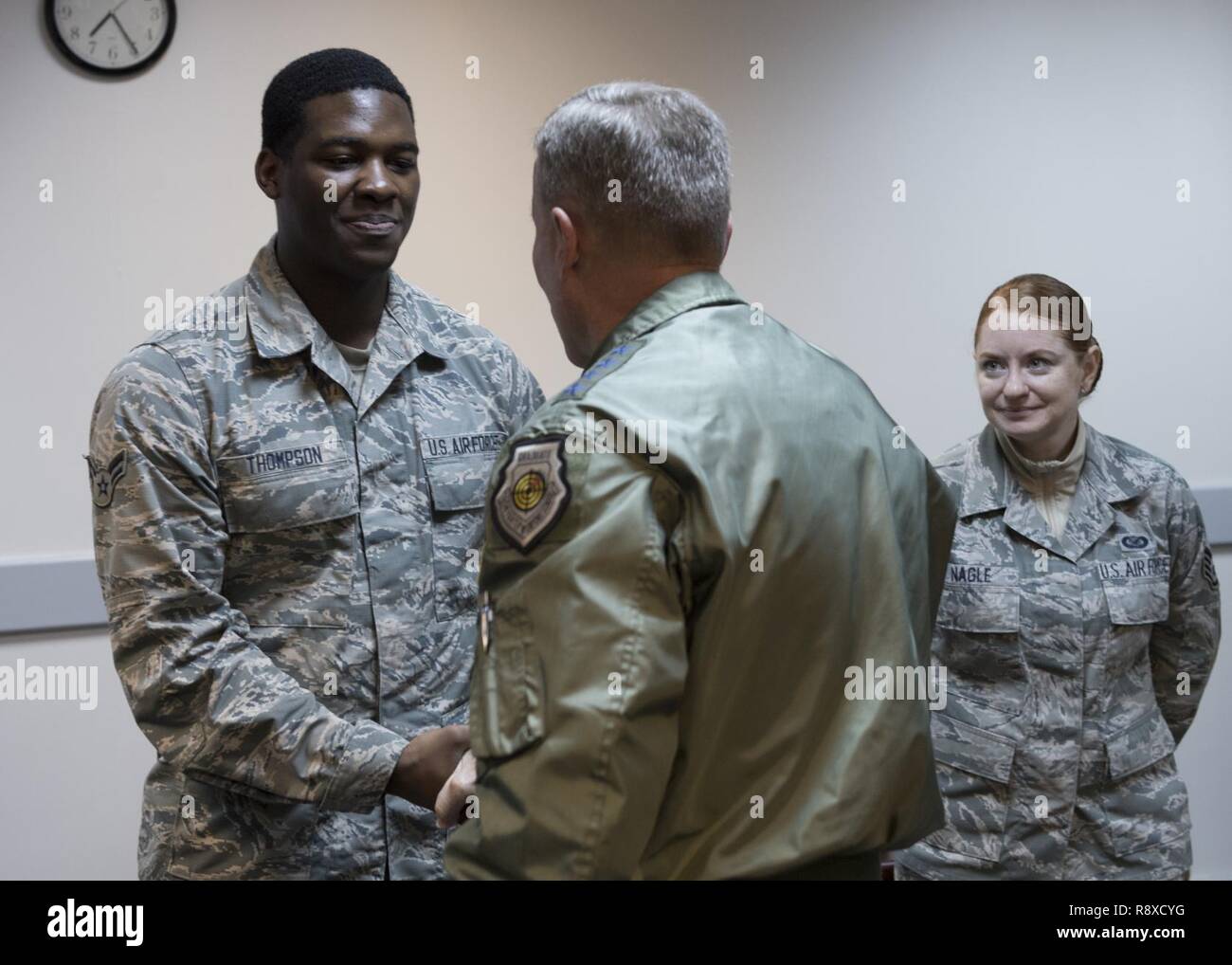 U.S. Air Force Airman 1st Class Octavius Thompson, 39th Air Base Wing photojournalist, receives ...