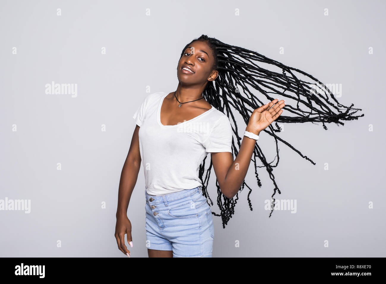 Fascinating african woman with happy face expression playing with her ...