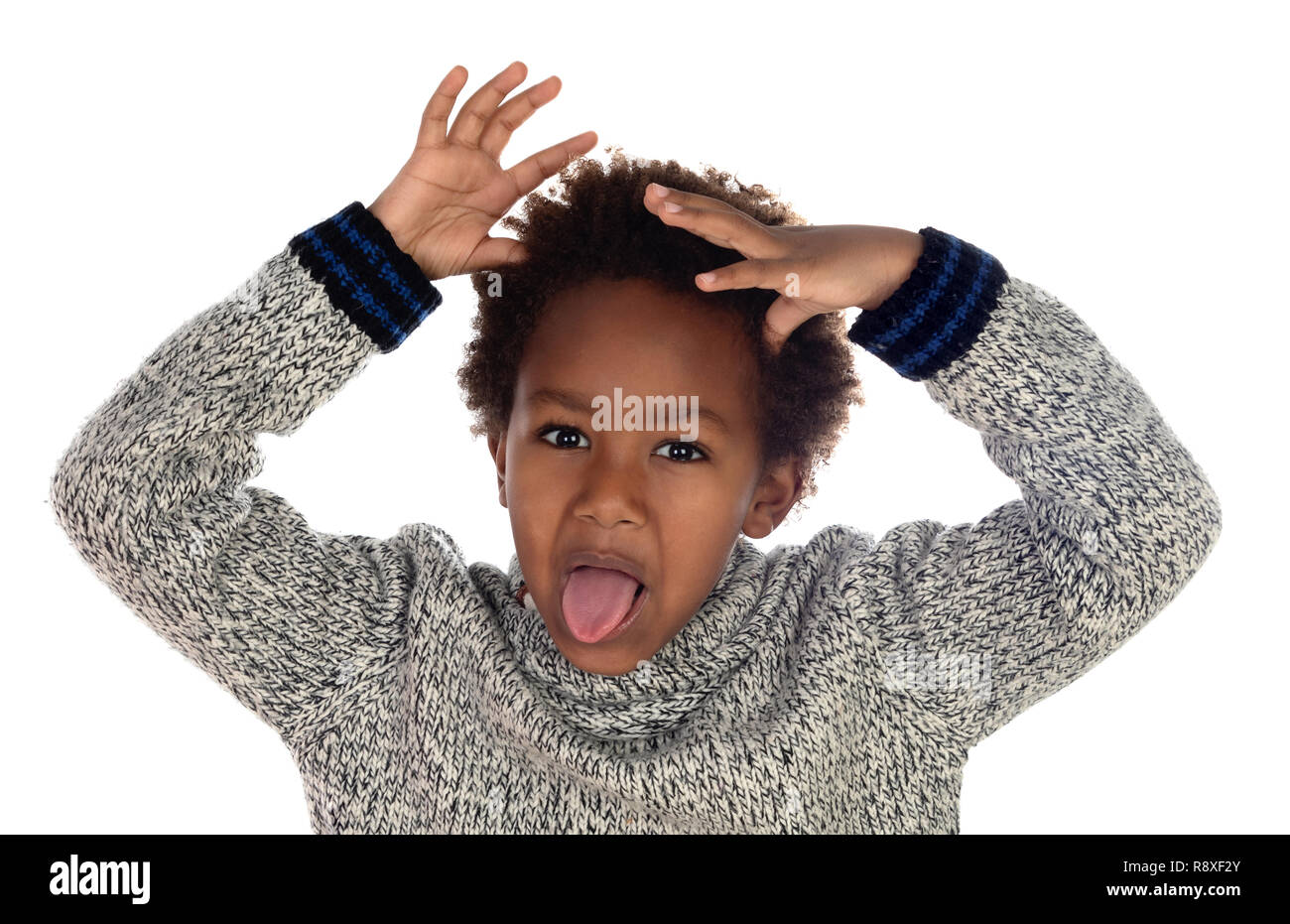 Funny expression of a small african child isolated on a white ...