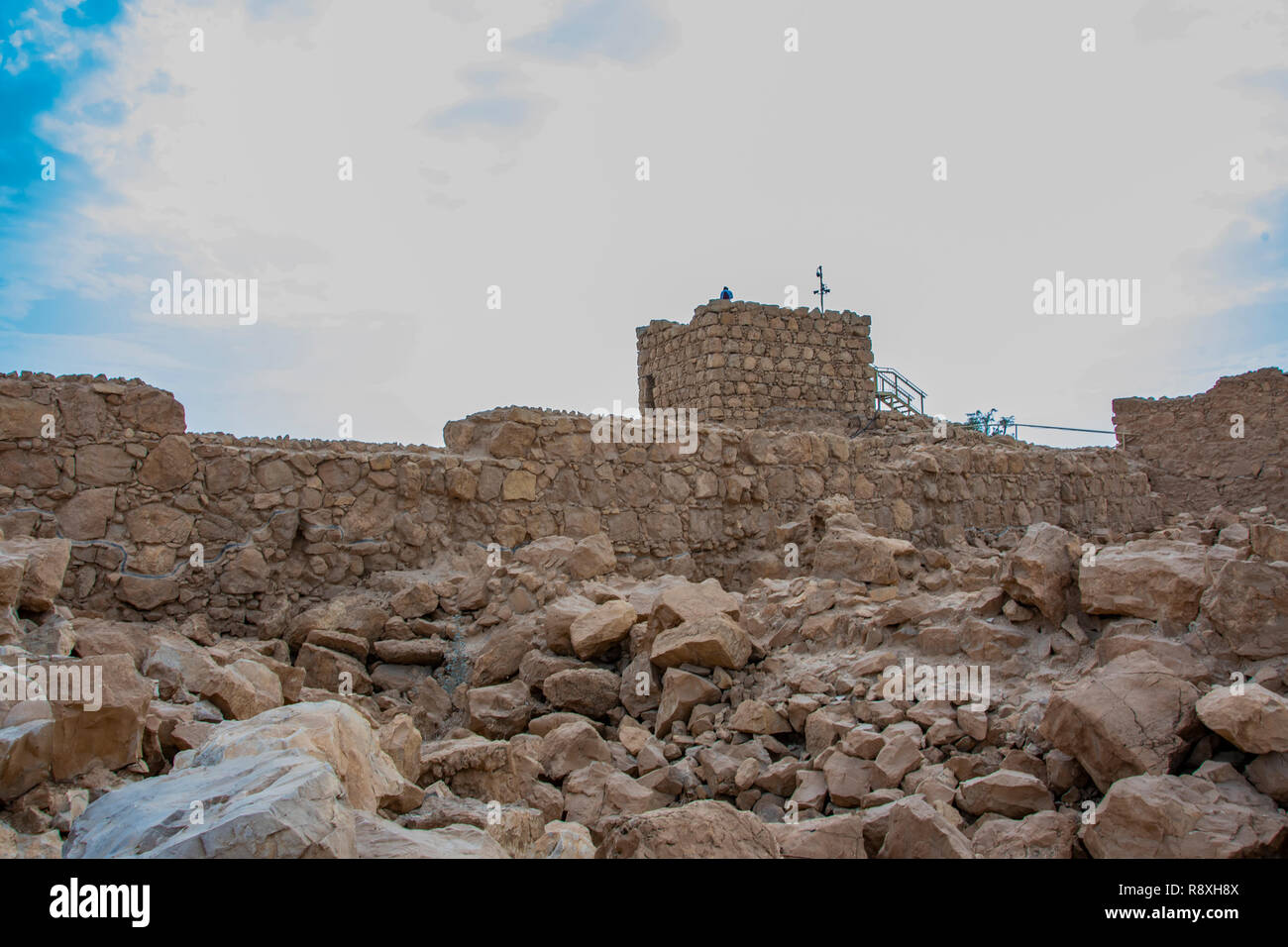 ruins of the fortress of masada. on the stone walls there is a black ...