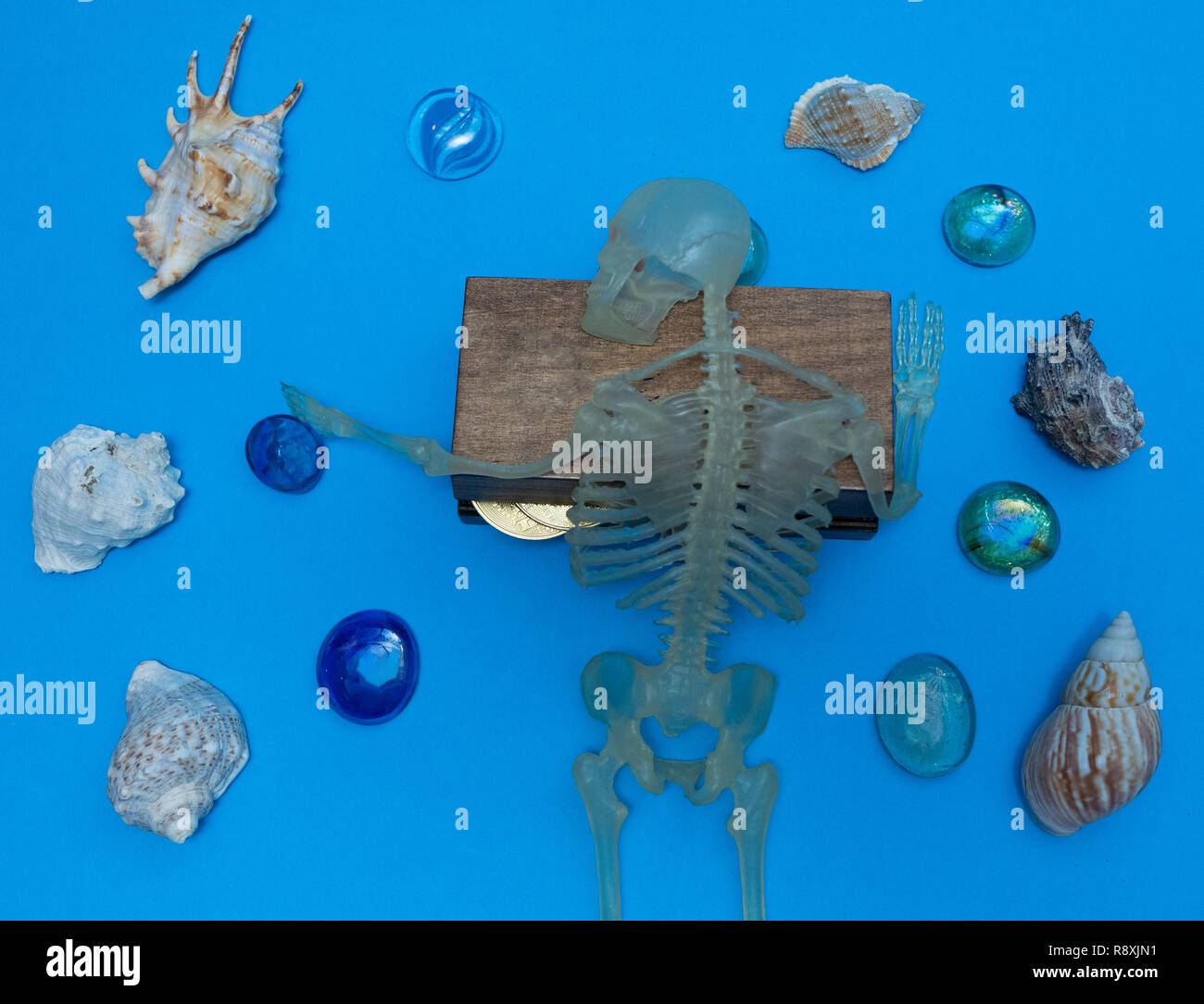 closeup of greed pirate who hugs treasure chest with few golden coins ...