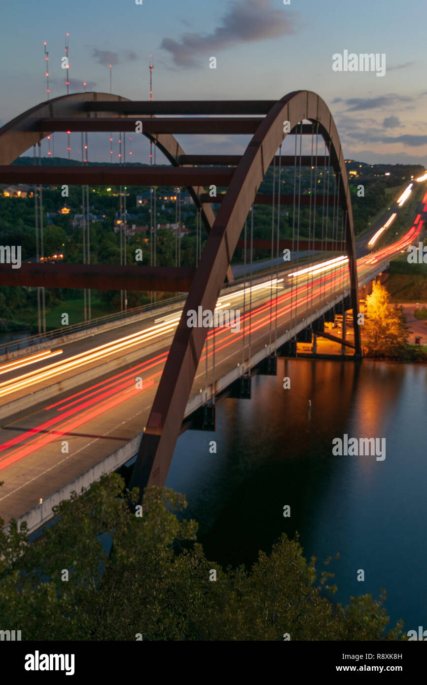 A busy flow of traffic crosses the iconic Pennybacker Bridge, known by ...