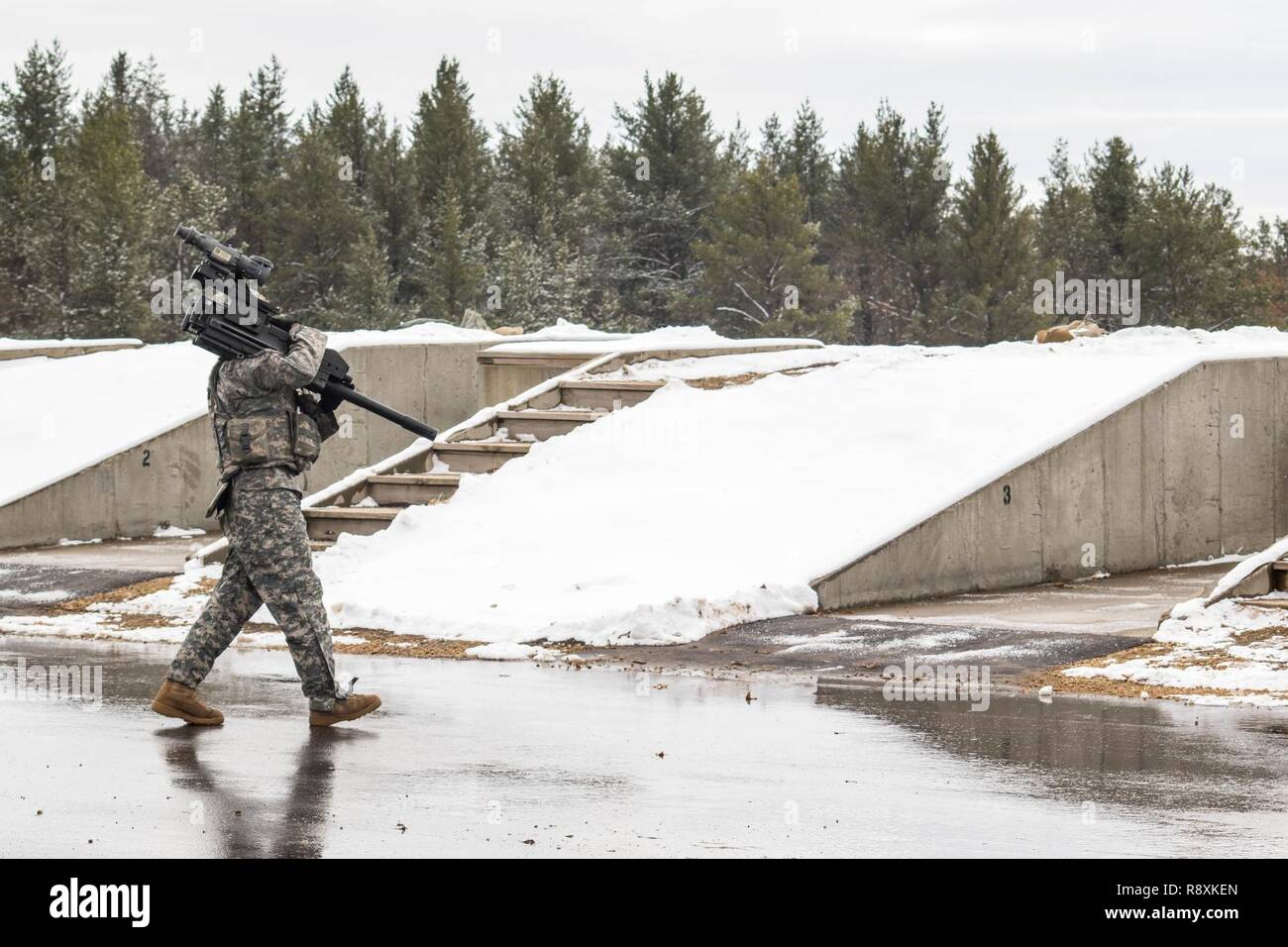 A U.S. Army Reserve Soldier carries the MK-19 automatic grenade ...