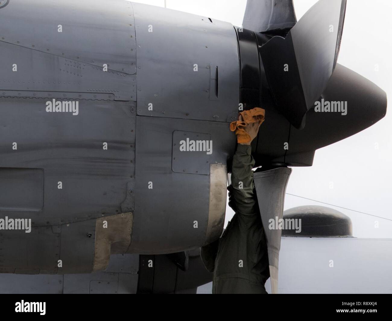An Airman with the 374th Operations Group does a post flight inspection ...