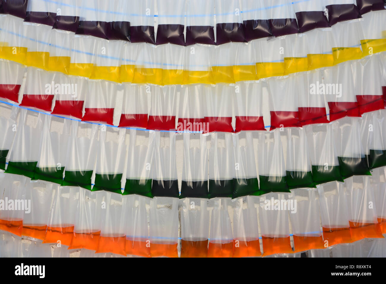 Colorful water in plastic bags Stock Photo - Alamy