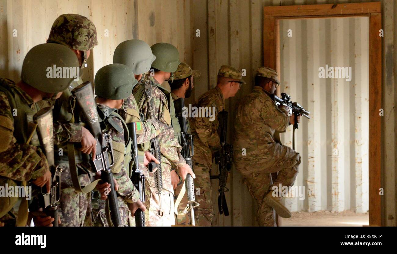 Two advisers from Task Force Forge demonstrate how to clear a room ...