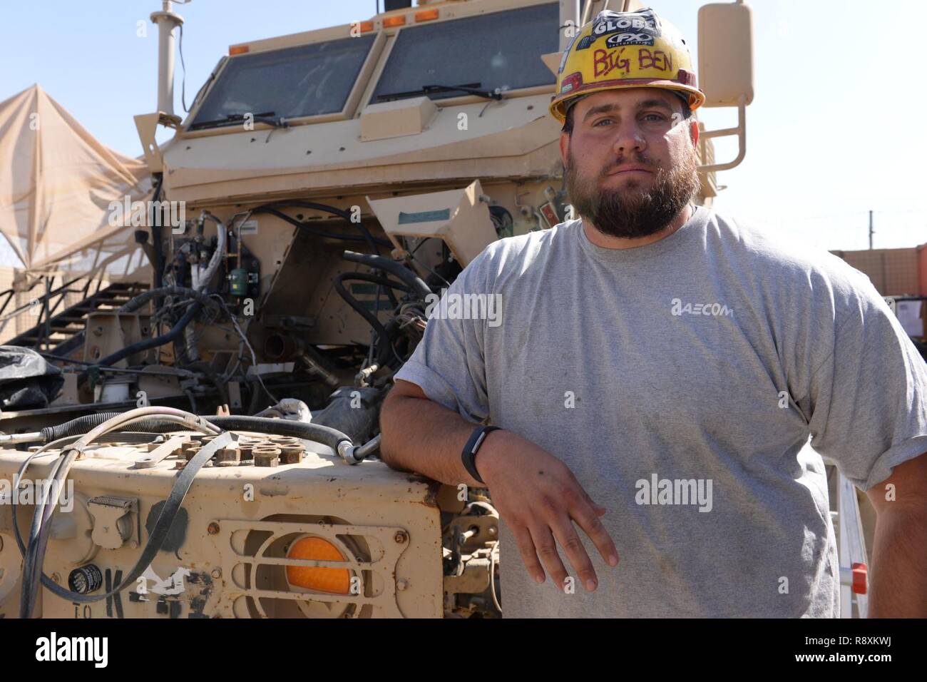 Timothy McDermott, a U.S. Army veteran, leans against a Mine Resistant ...