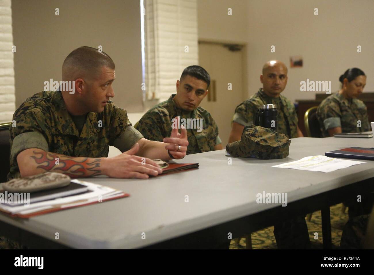 U.S. Marine 1st Sgt. Brian Anderson shares with his group his ...