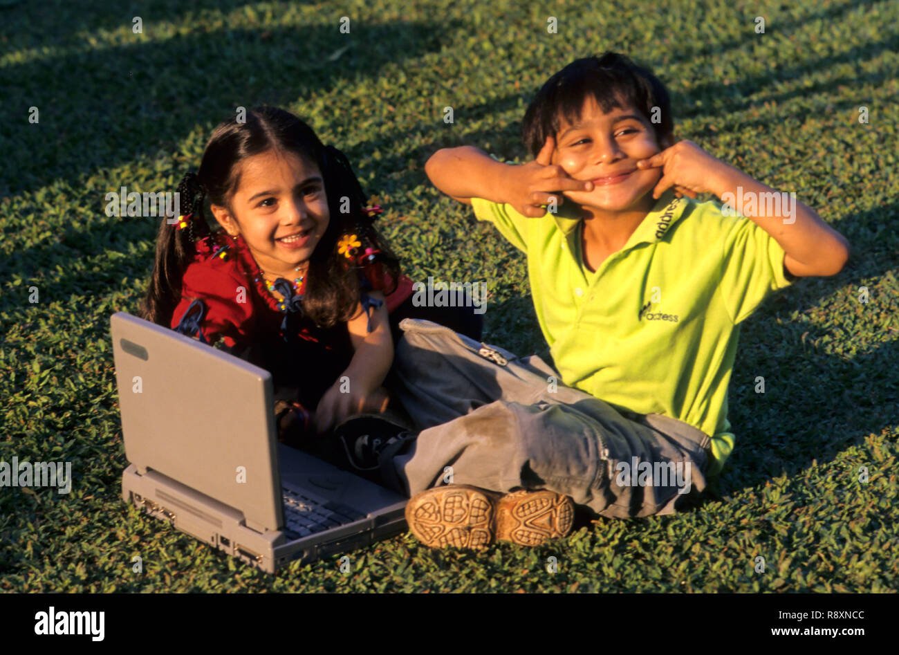 Two children playing on computer MR#273 Stock Photo - Alamy