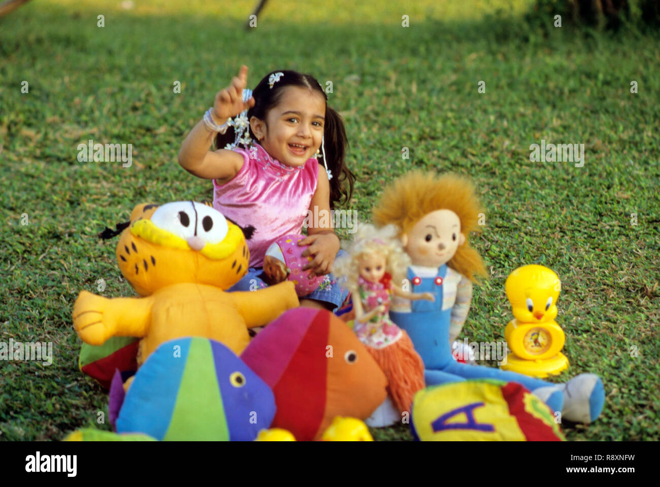 Girls playing with dolls hi-res stock photography and images - Alamy