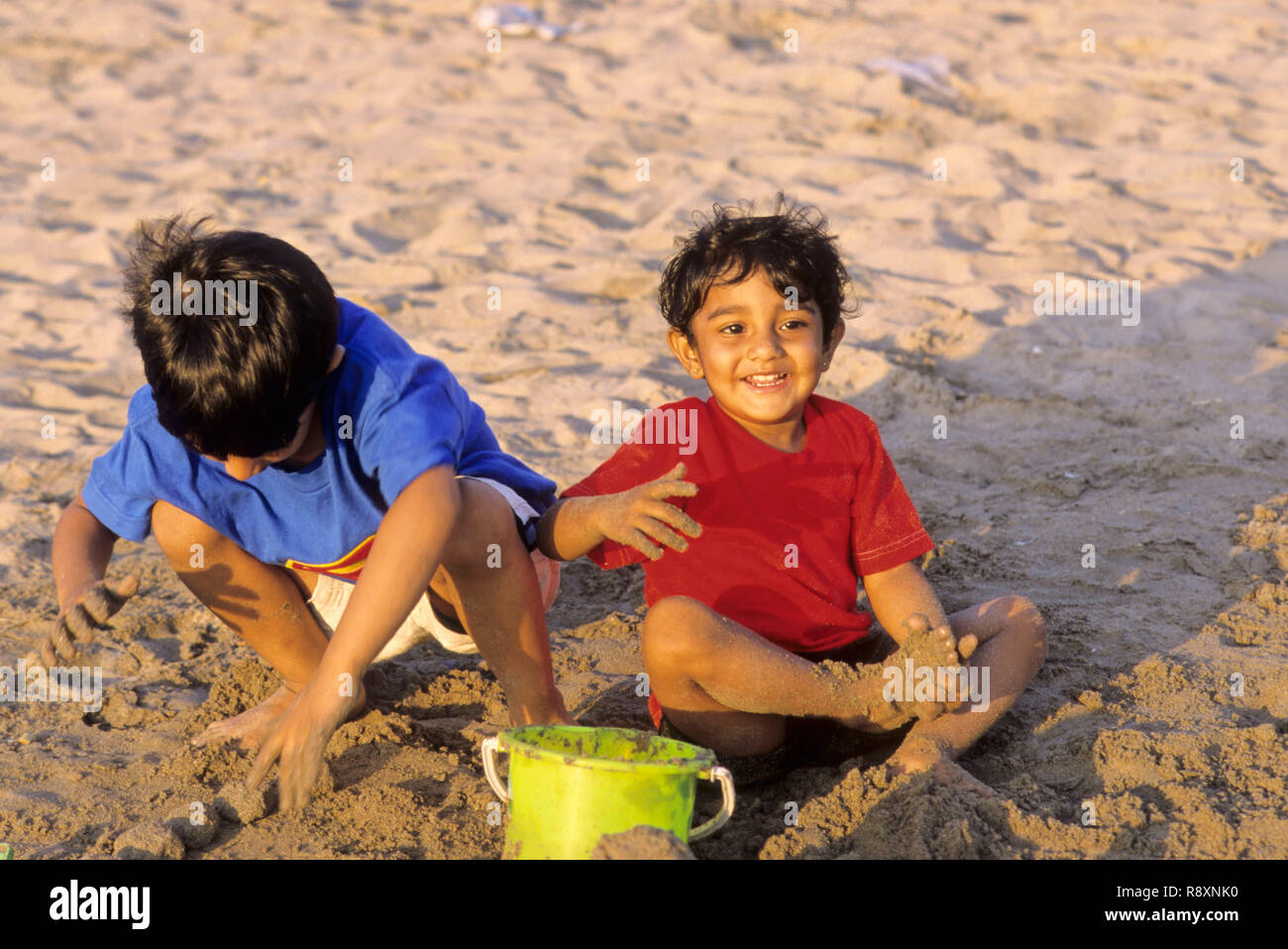 Children Playing In Sand Stock Photo - Alamy