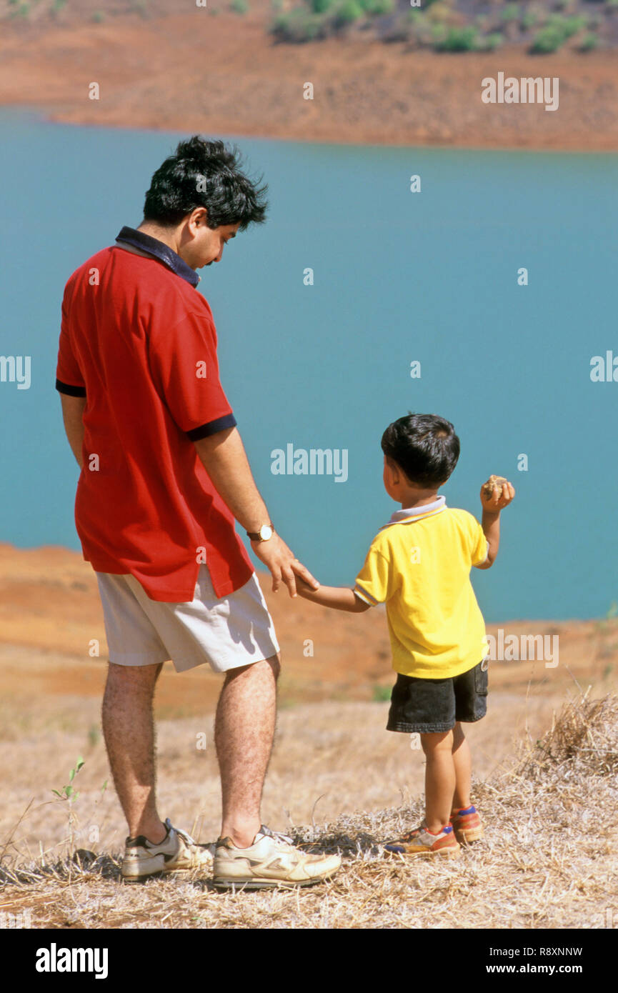 man holding hand of son MR.NO.152 Stock Photo - Alamy
