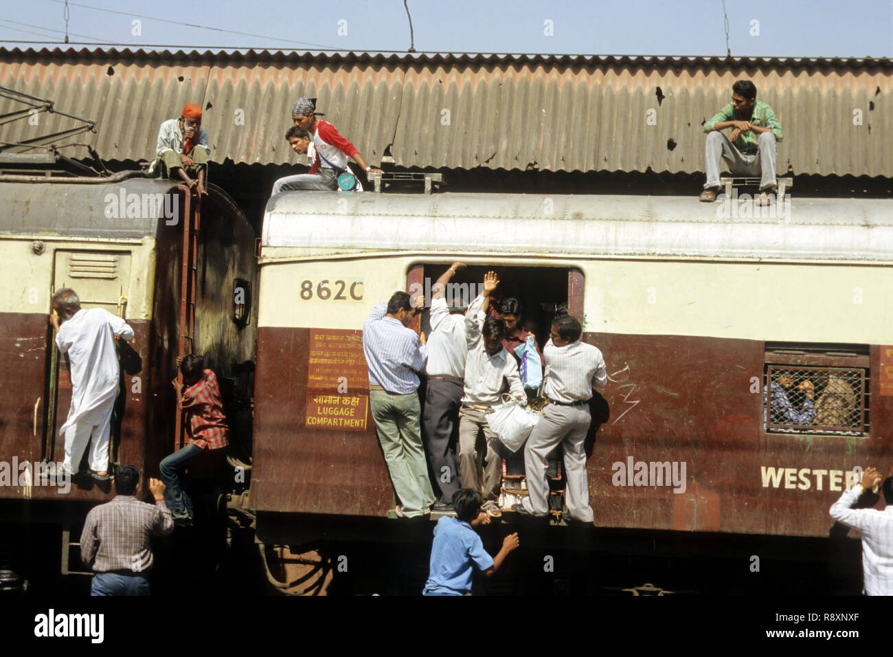 People crowd local train, suburban railway, Bombay, Mumbai, Maharashtra ...