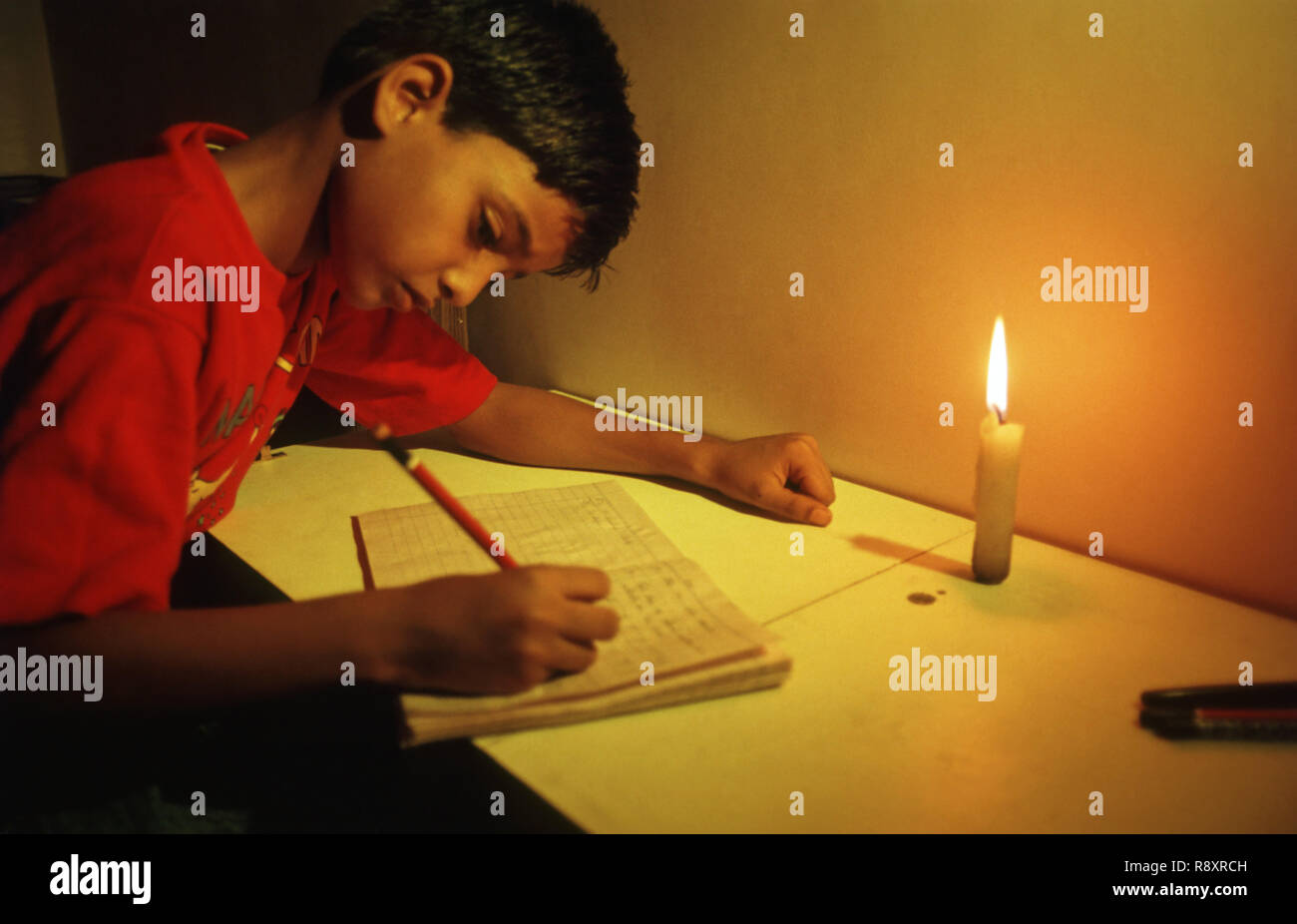 young boy studying in candle light Stock Photo - Alamy young boy studying in candle light Stock Photo - Alamy