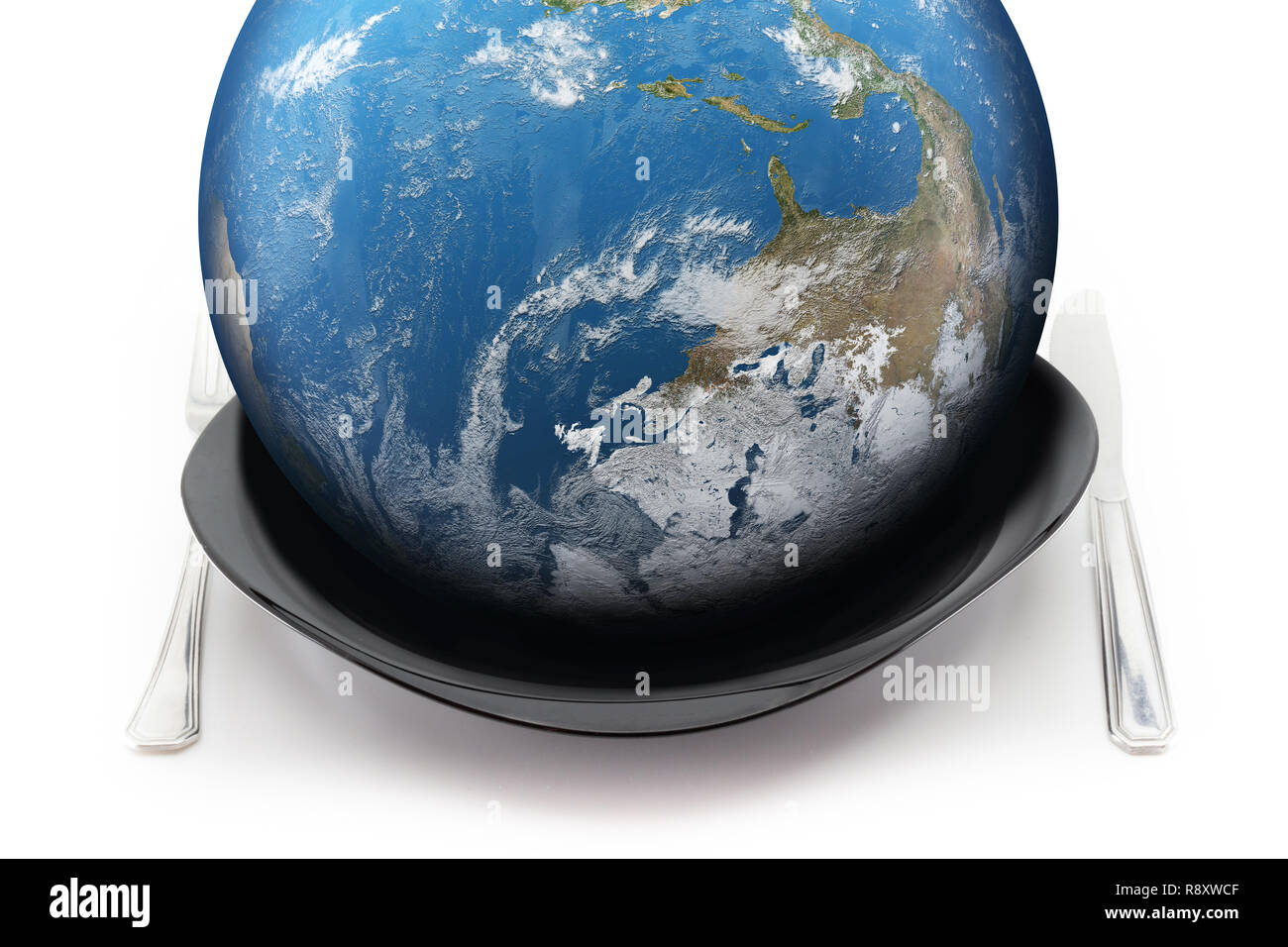 Consuming our Planet, concept. Earth served on plate Stock Photo - Alamy
