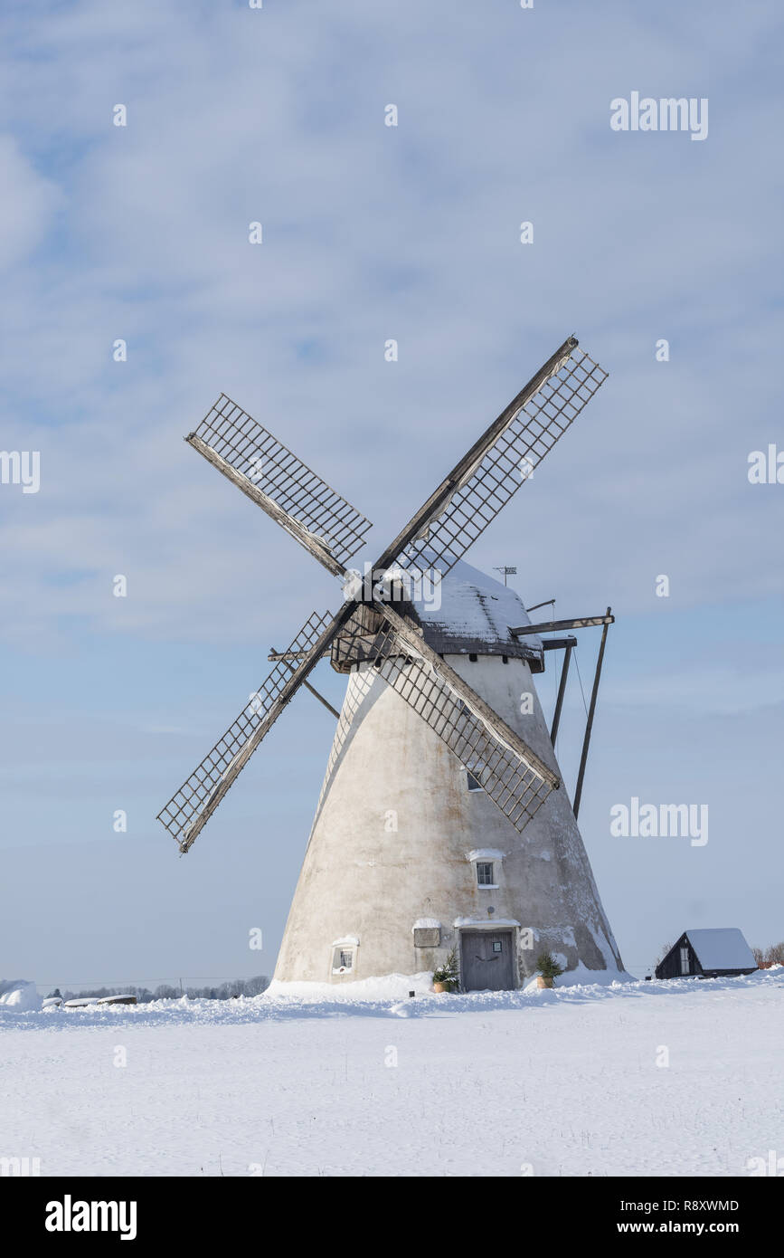 Grain mill on the winter landscape. Dutch windmill and natural ...