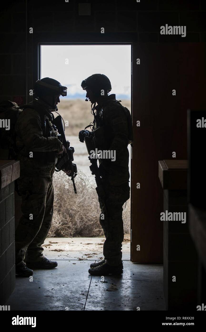 Two pararescueman with the 308th Rescue Squadron, communicate, March 2 ...