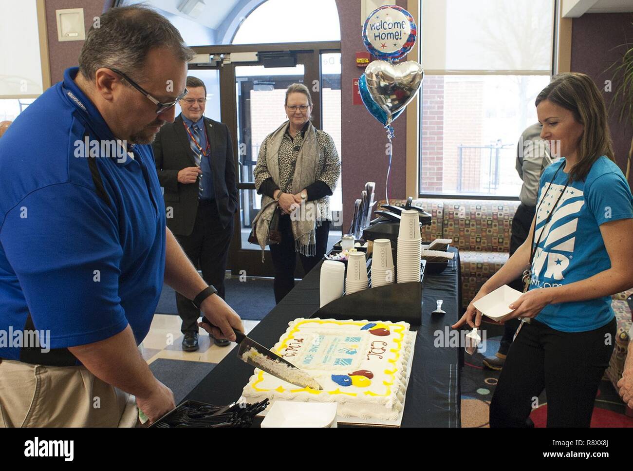 DSCC Chief of Morale, Welfare and Recreation Brandon Doherty slices ...