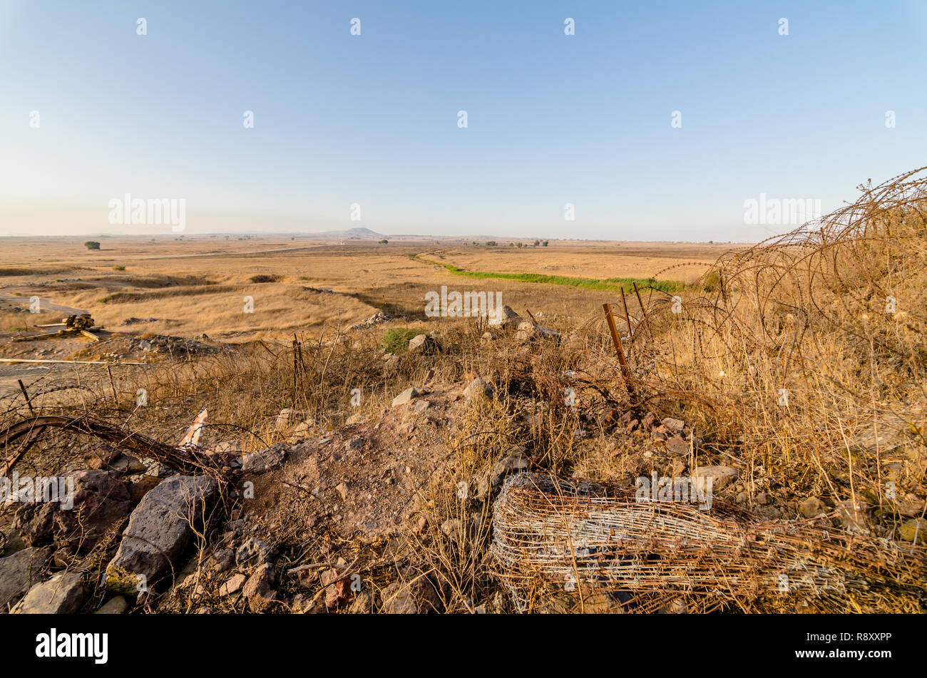 Countryside at Israeli and Syrian border with remaining barbed wire ...