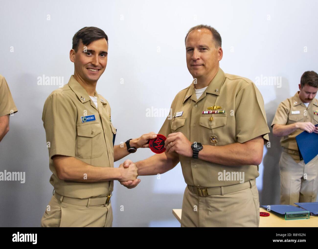 From the right, Cmdr. Steven McDowell, deputy director for Naval ...
