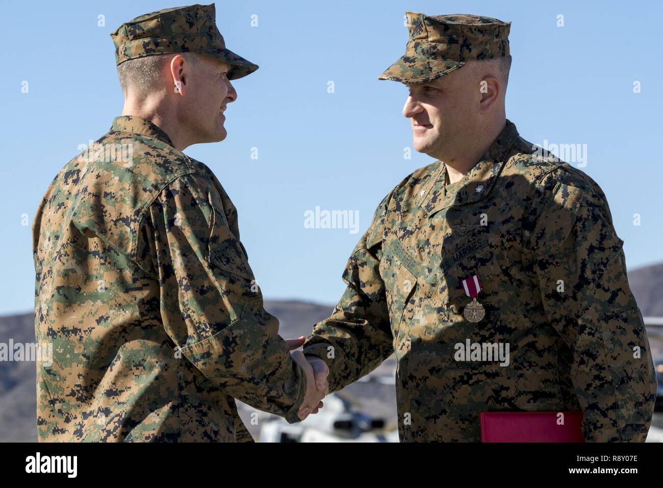 U.S. Maine Corps Lt. Col. Jonathan E. Bidstrup (right), commanding ...