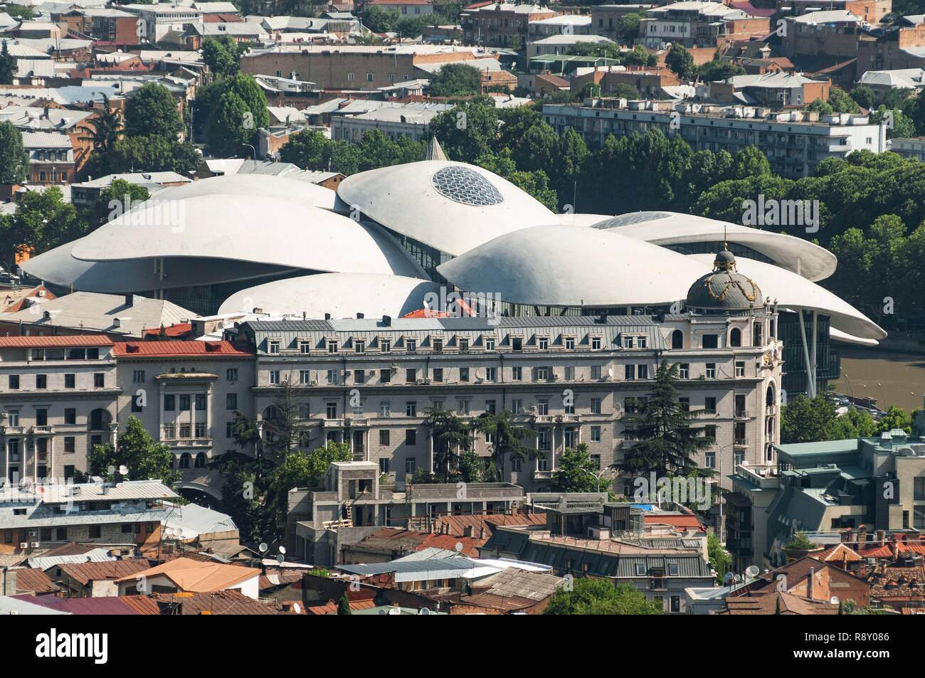 Georgia, Tbilisi, Circa administrative building on Kura river in ...