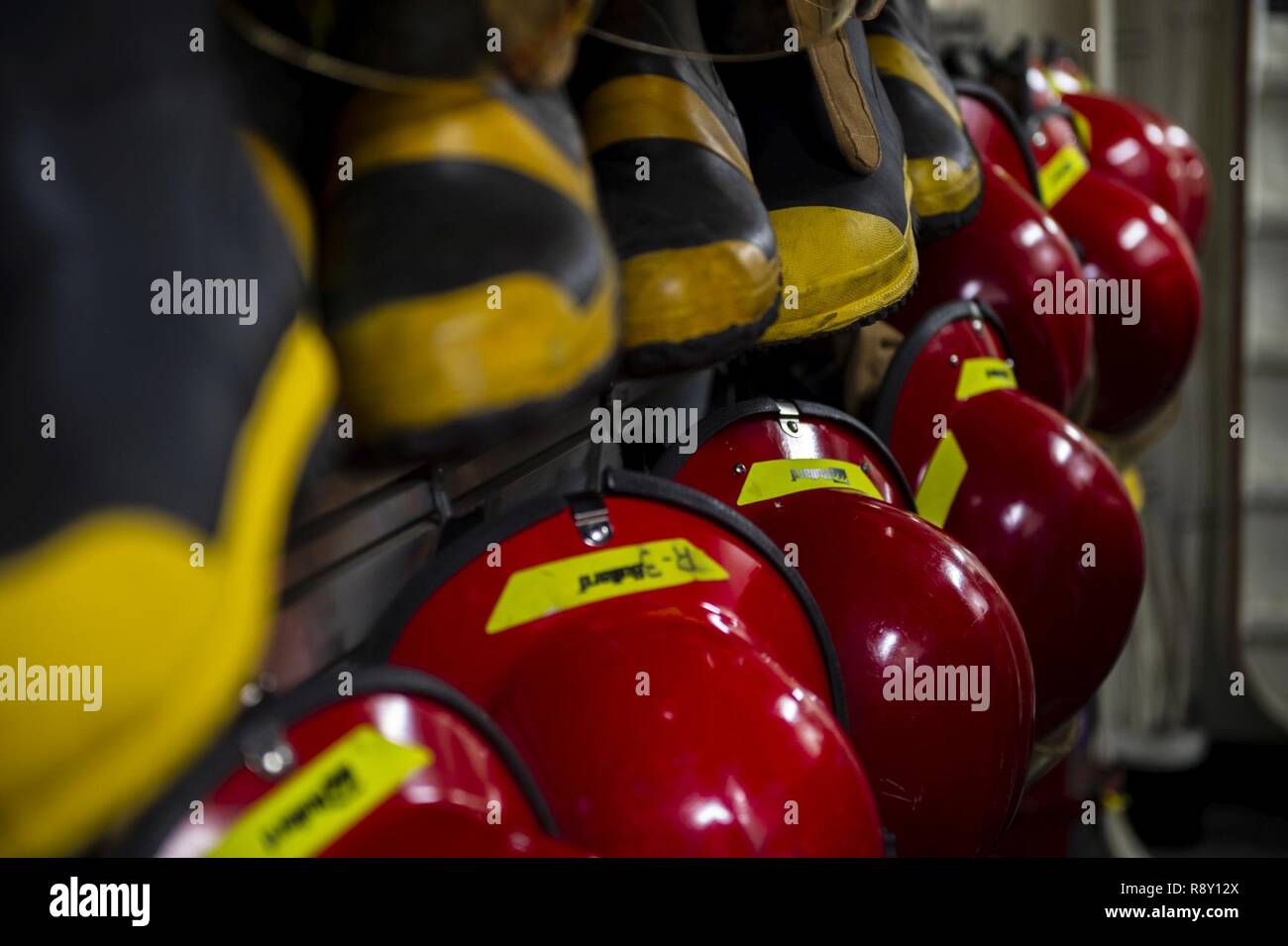 Firefighting equipment (FFE) hangs on a bulkhead aboard the guided ...
