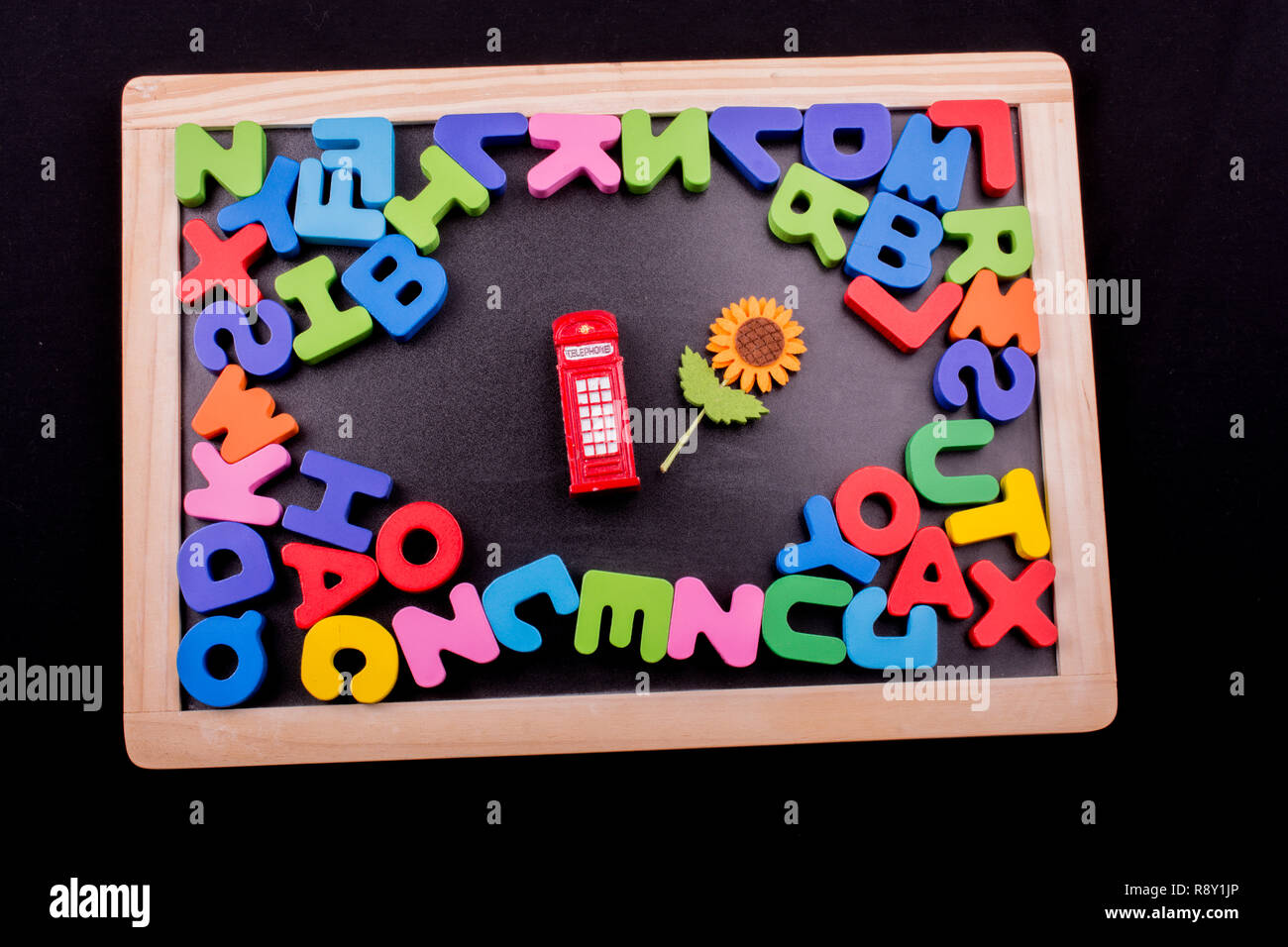 Telephone booth and colorful letters of Alphabet made of wood Stock ...