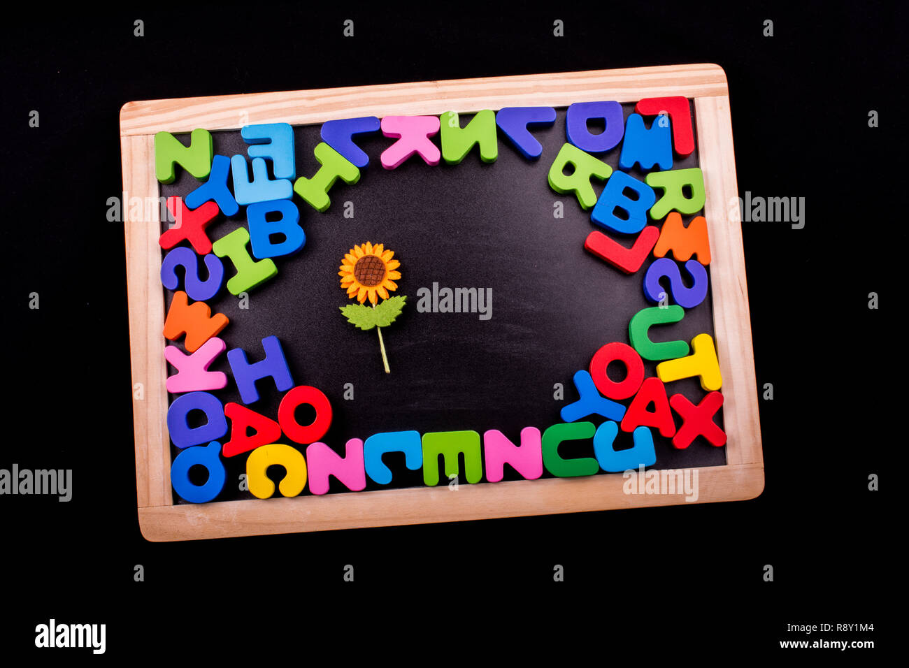 Fake flower and colorful Letters of Alphabet made of wood Stock Photo ...