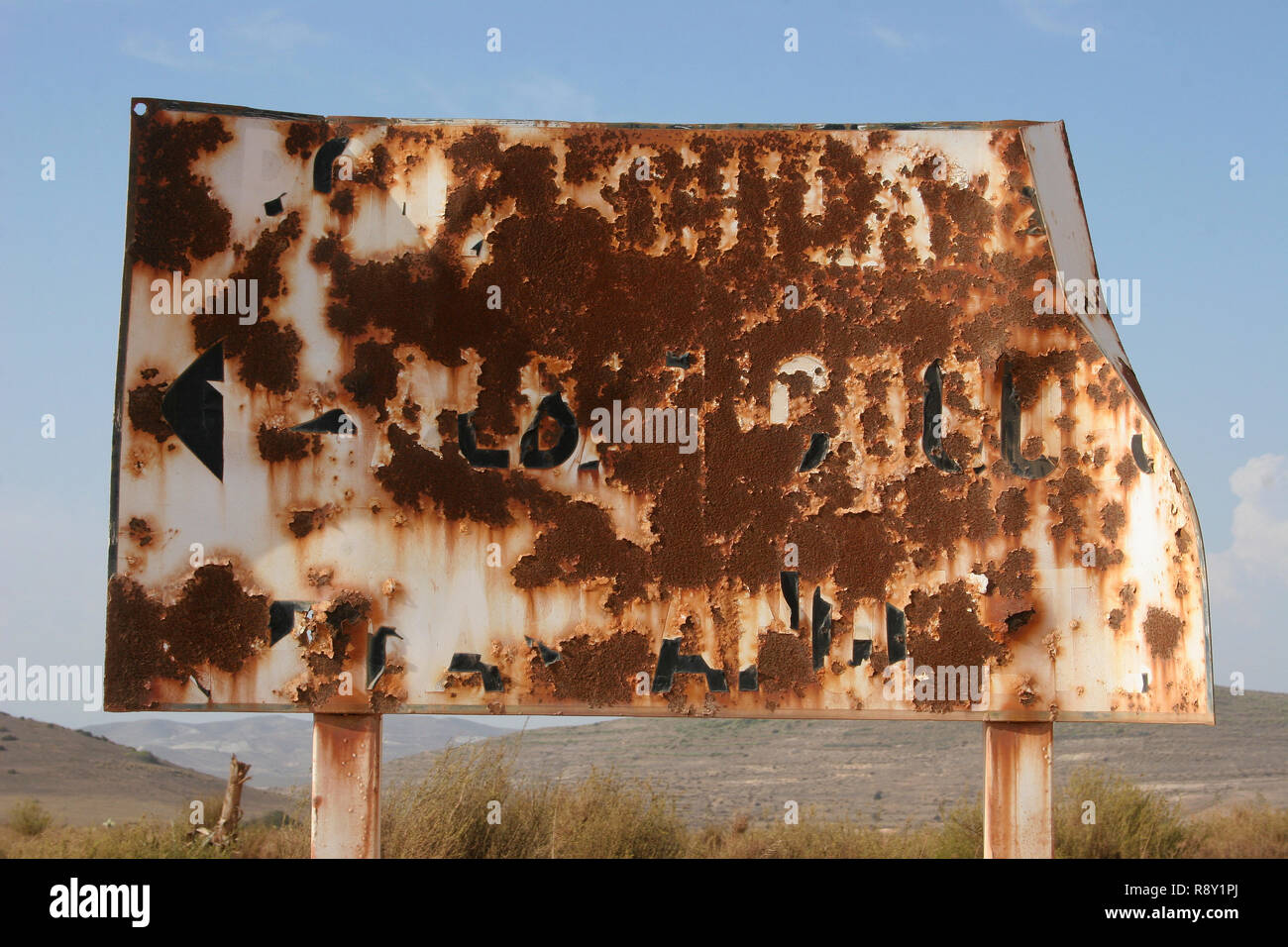 rusty old sign, old rusty metal with holes, abandoned information ...