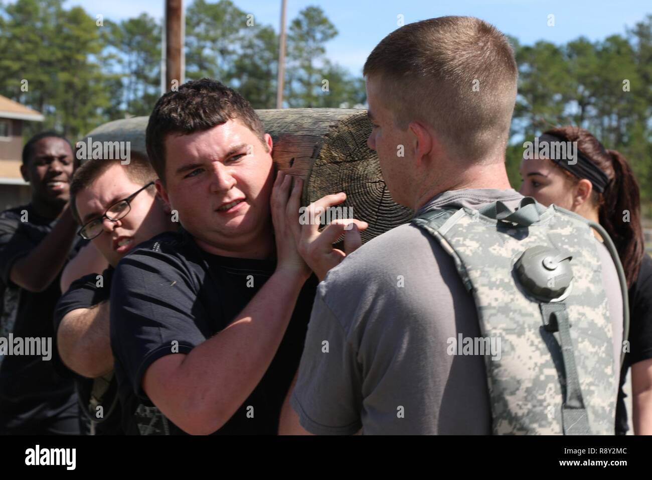 Soldiers struggle to carry a light pole during the Spartan Challenge at ...