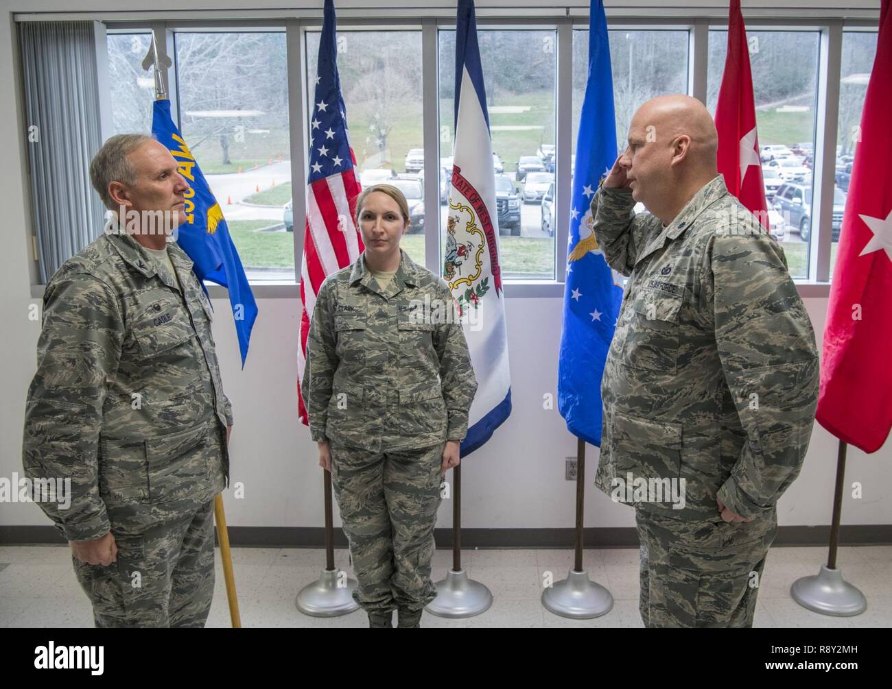 Lt. Col David Lester, right, renders a salute to 130th Mission Support ...