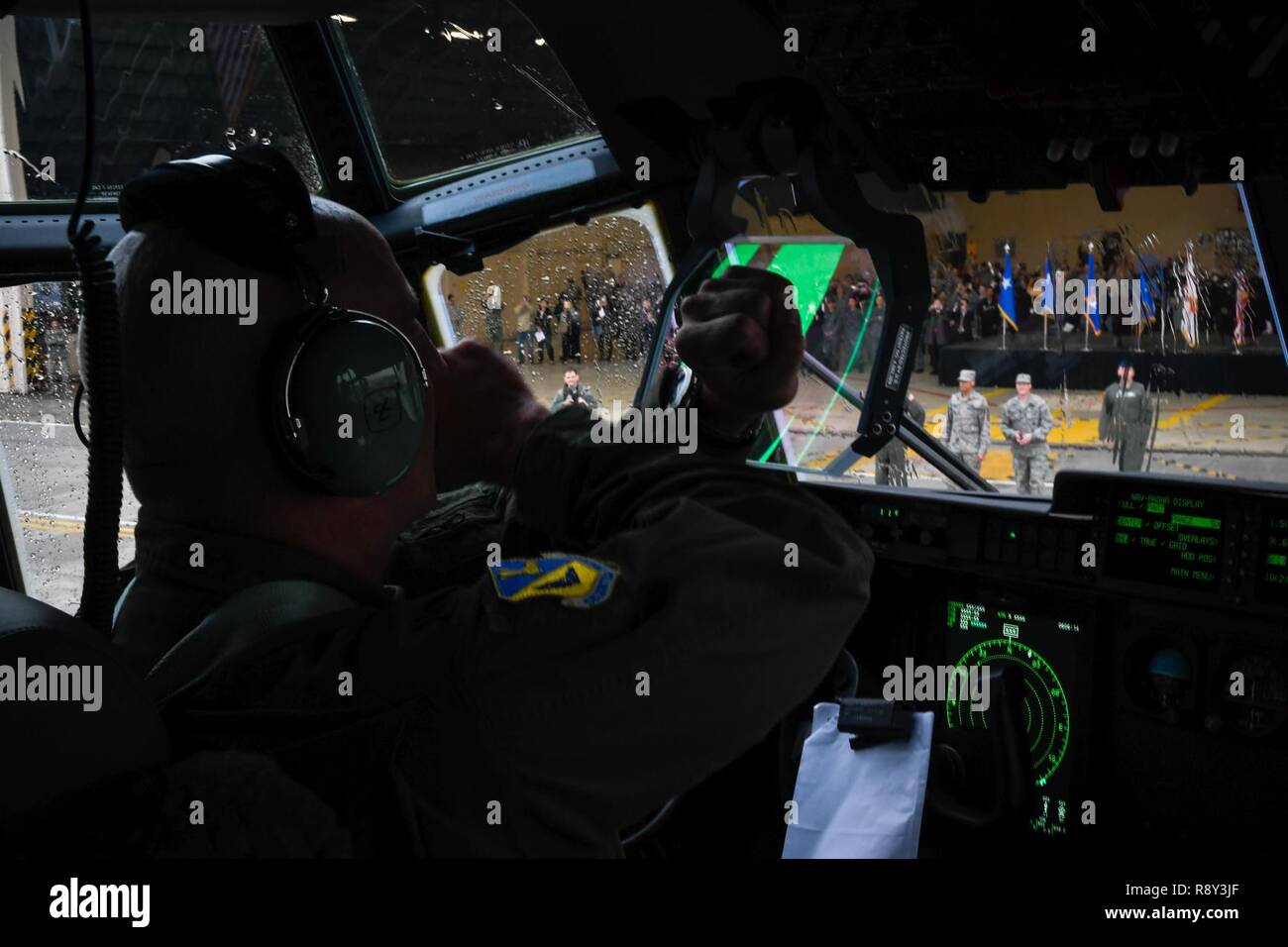 Col. Kenneth Moss, 374th Airlift Wing commander, signals to a crew ...