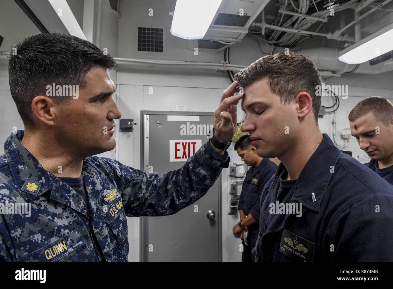 SOUTH CHINA SEA (March 1, 2017) Lt. Cmdr. Jeffrey Quinn (left ...