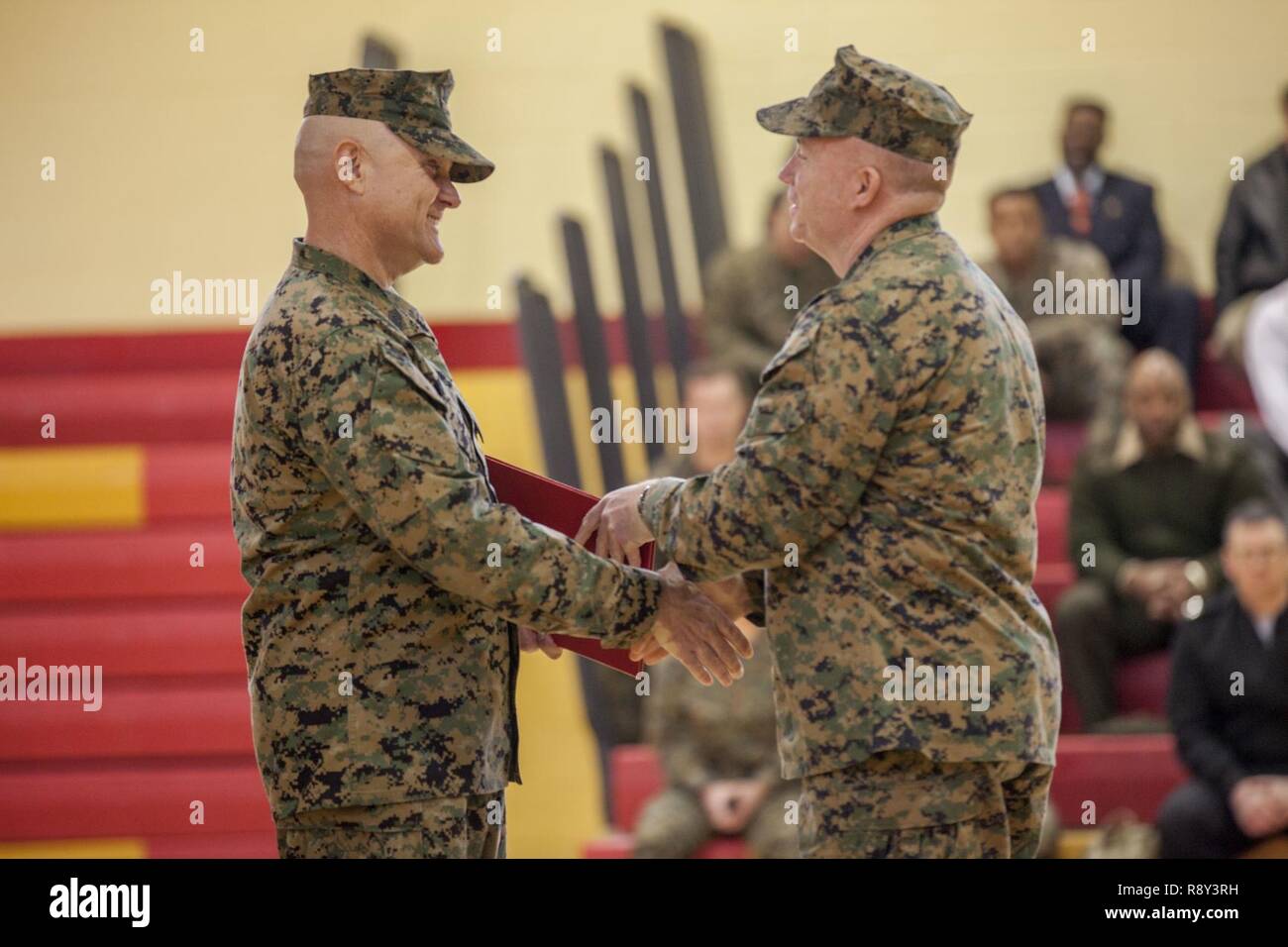 U.S. Marine Corps Sgt. Maj. Robert W. Pullen, left, is presented with ...
