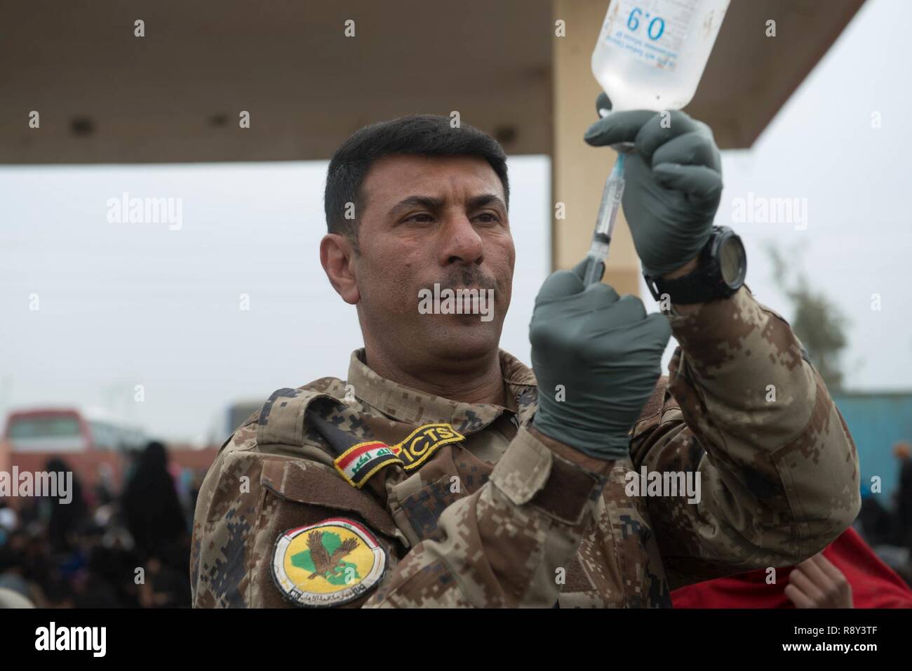 Iraqi Counter Terrorism Service senior medic Sallah Kahdum preps an ...