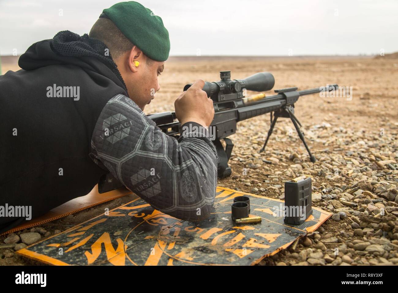An Iraqi security forces soldiers reloads his T-5000 sniper rifle ...