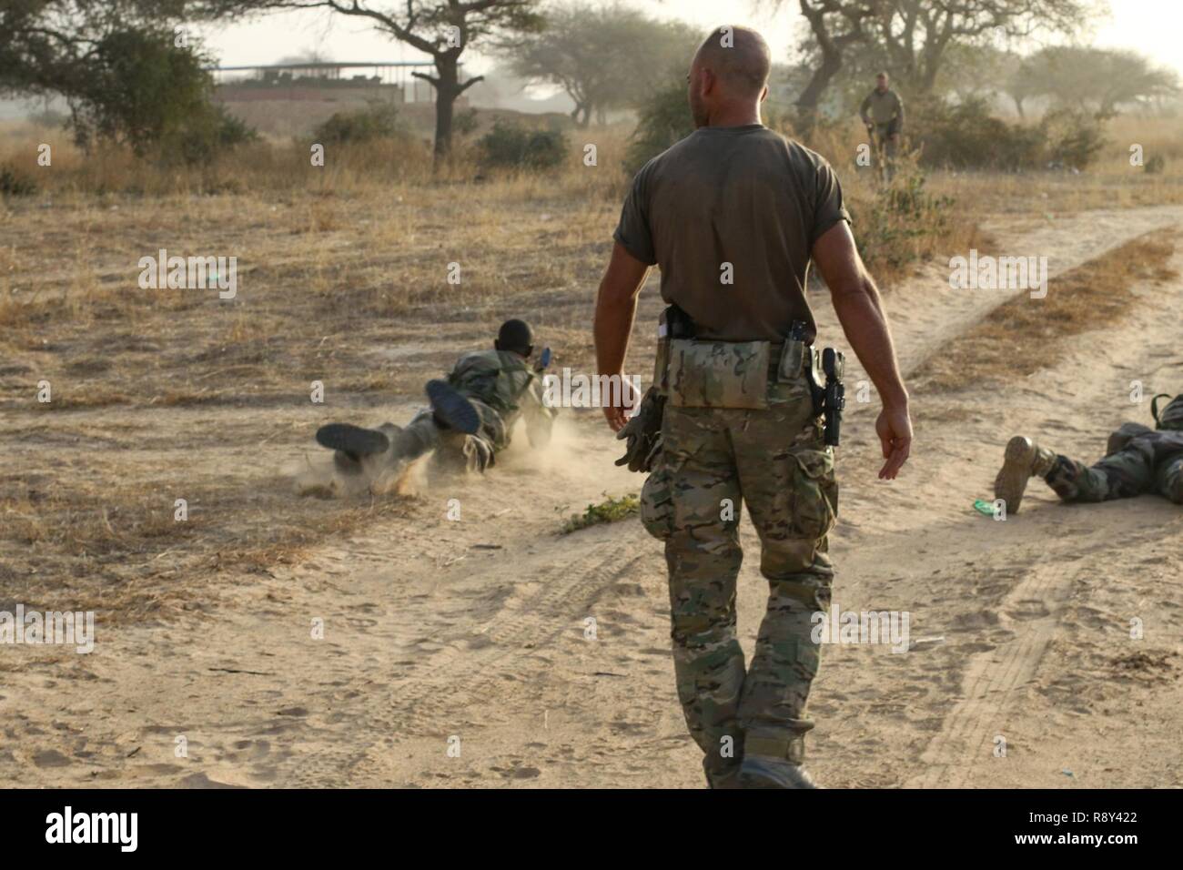 A Belgian Special Operations soldier observes Nigerien soldiers as they ...
