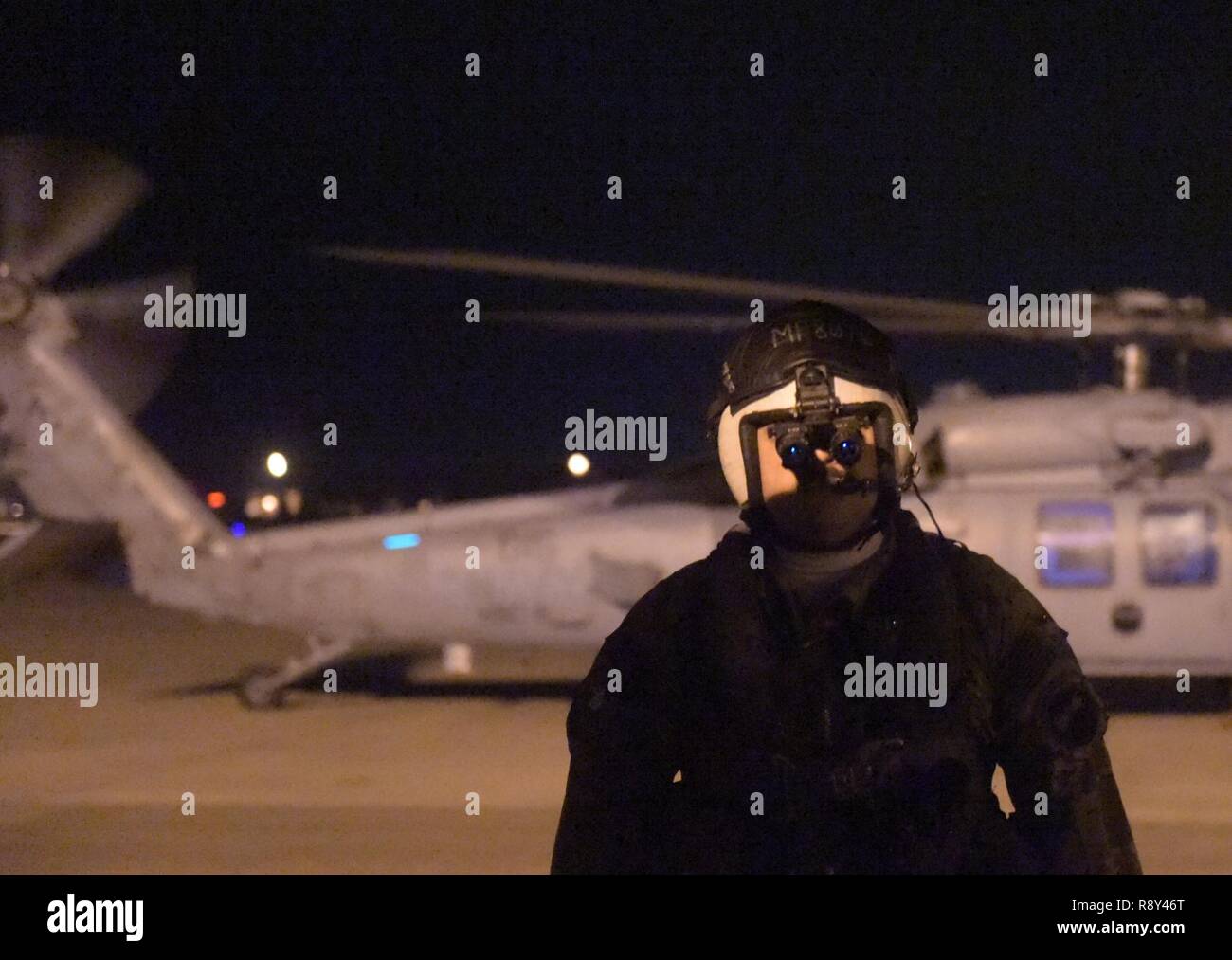 A U.S. Navy crew chief assigned to Helicopter Sea Combat Squadron FIVE ...