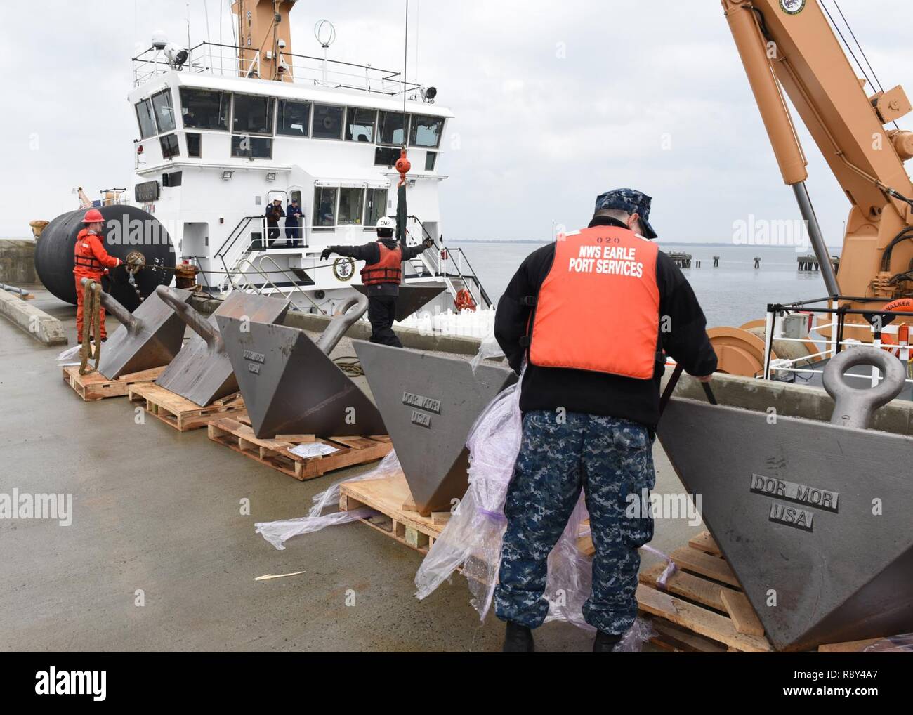 NEW YORK – Coast Guard and Navy members ready buoy equipment to be placed onboard Coast Guard ...