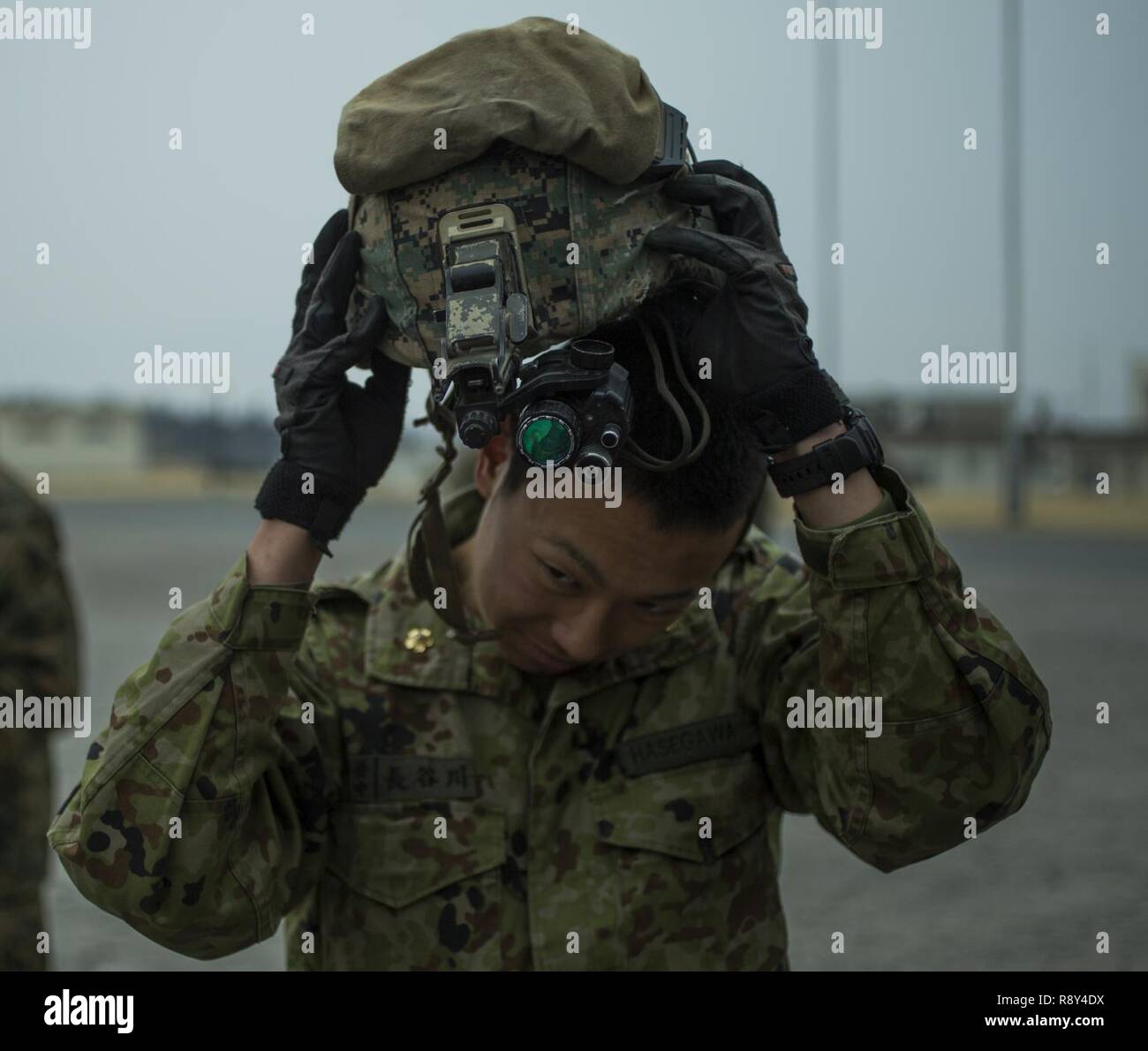 A Japanese Ground Self-Defense Force soldier tries on U.S. Marine Corps ...