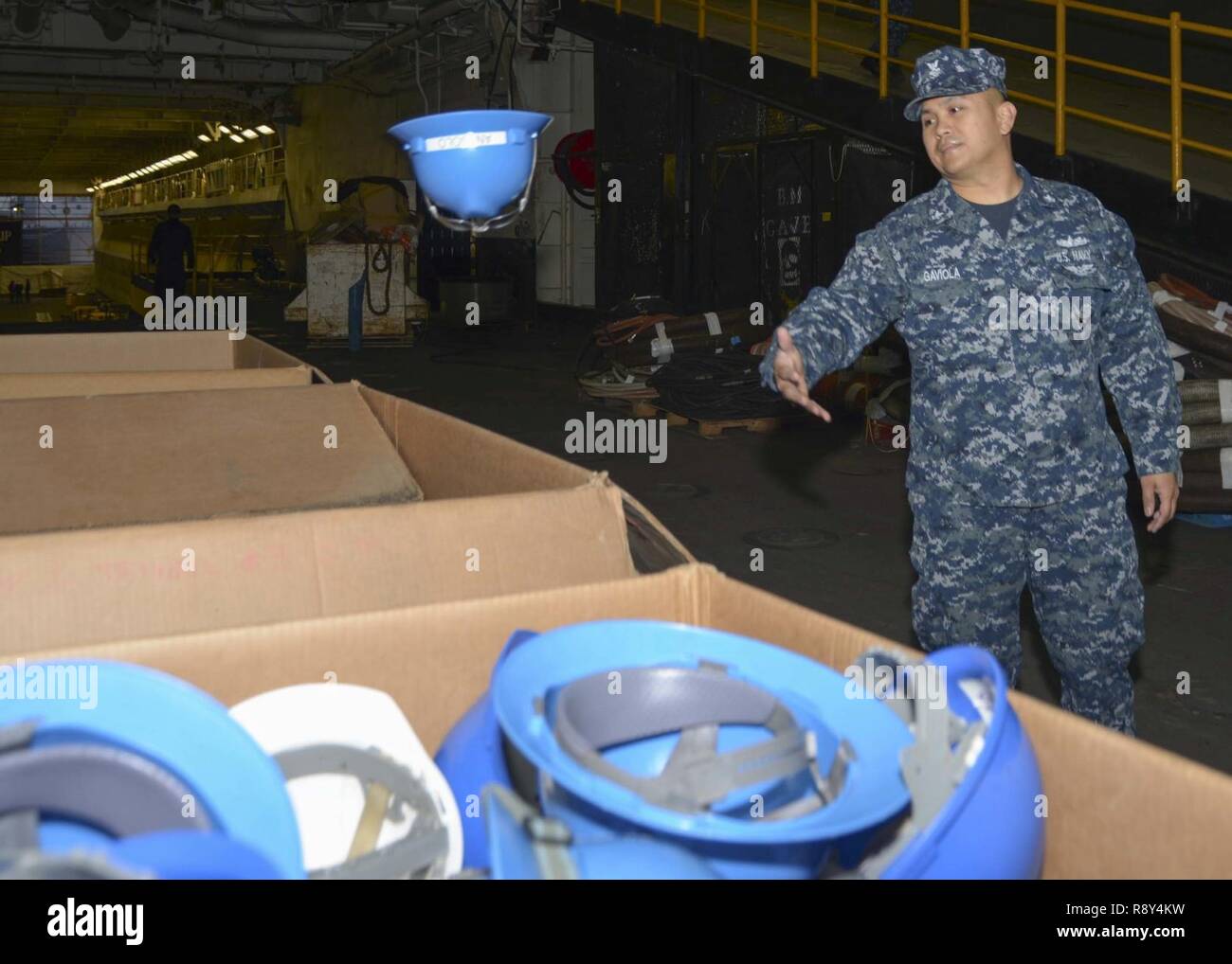 SAN DIEGO-- Ship's Storekeeper 2nd Class Jordanmanx Gaviola turns in ...