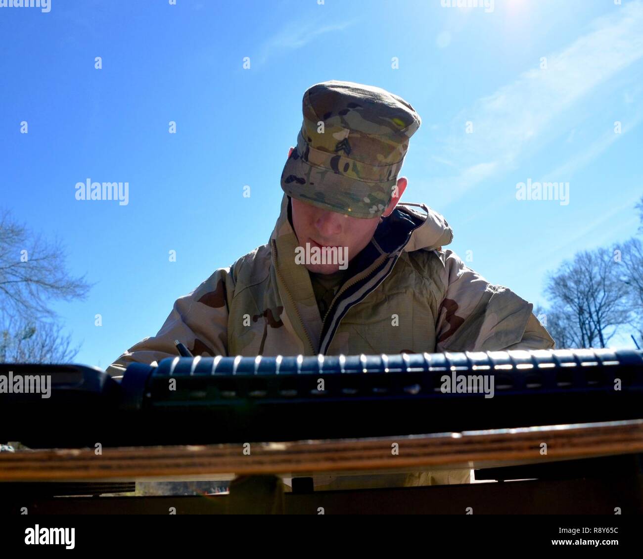SGT Brett T. Rutledge works through the steps listed before him at the ...