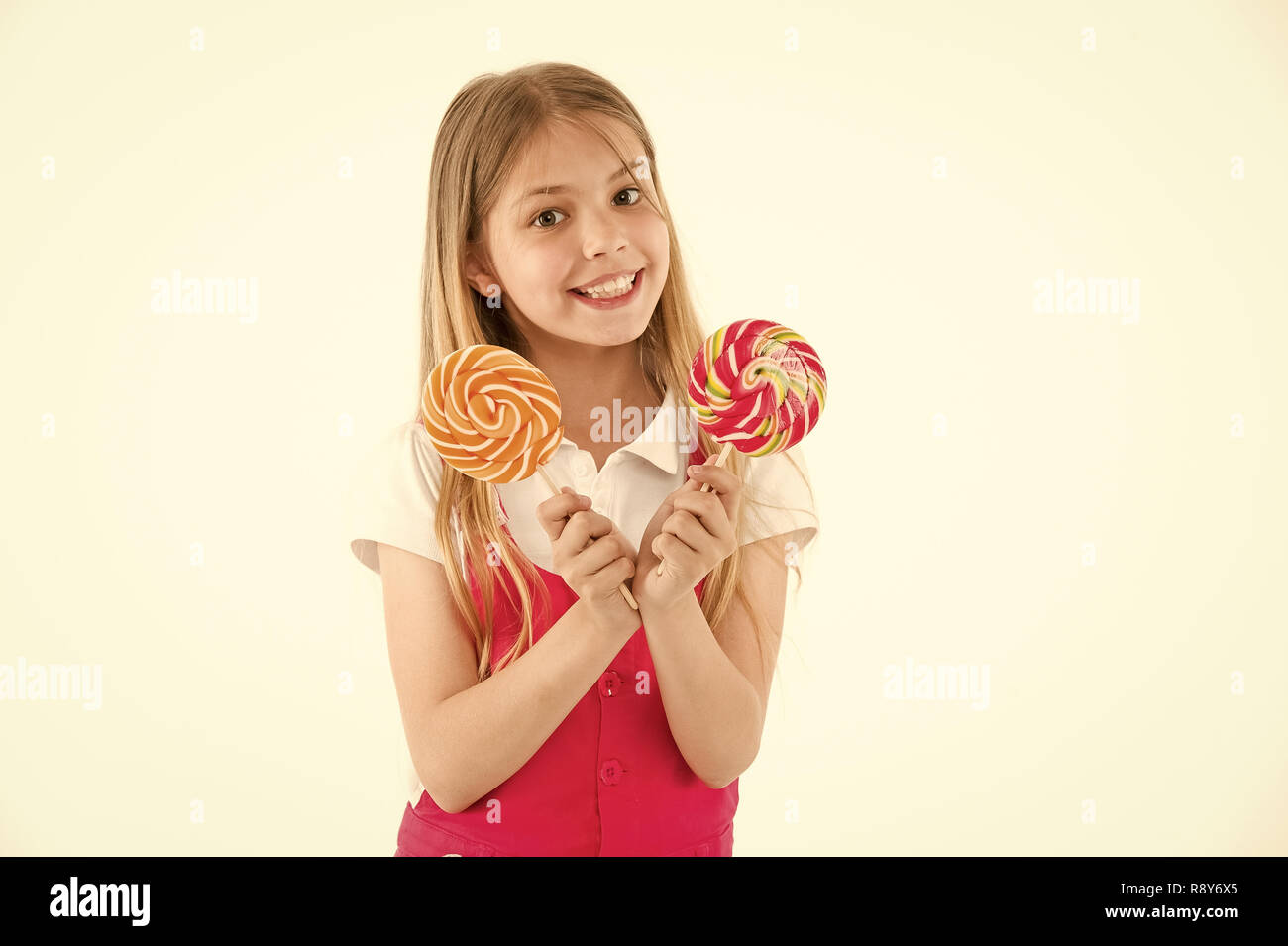 Extremely big lollipop. Little kid smile with candies on sticks ...