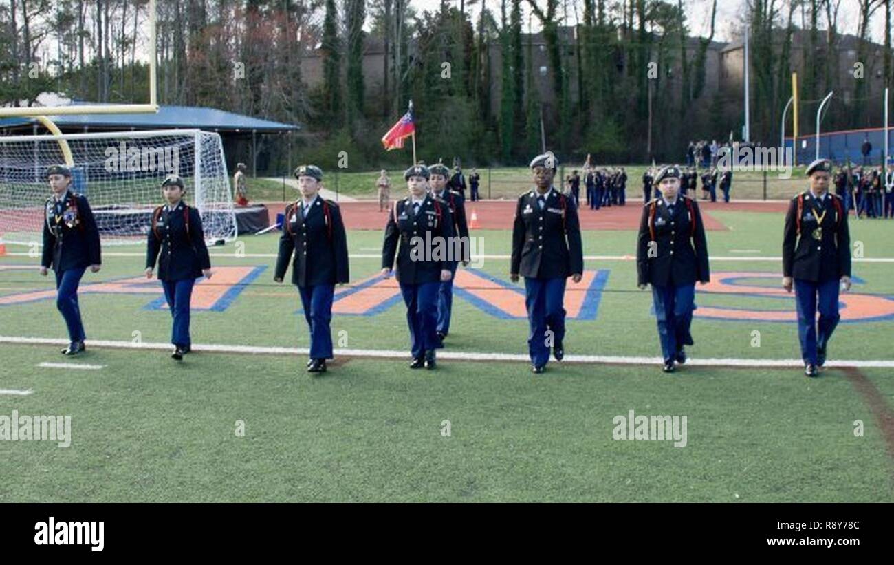 Unarmed female squad march together during a JROTC annual drill and ...