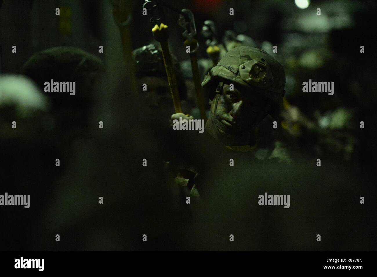 A U.S. Army paratrooper from the 82nd Airborne Division prepares for ...