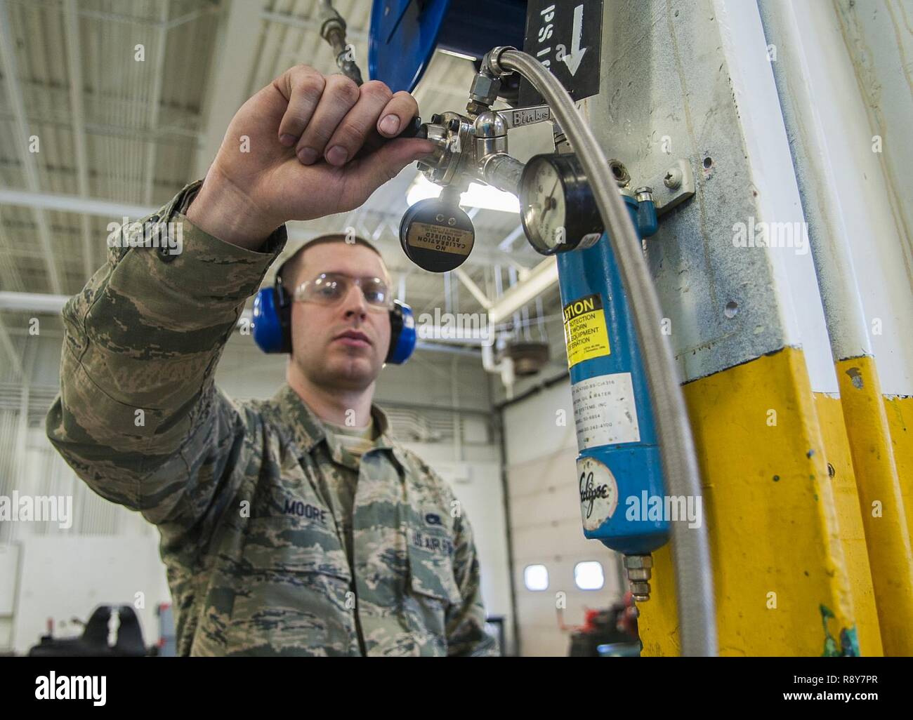 Senior Airman Daniel Moore, 5th Maintenance Squadron hydraulics journeyman, turns off an air ...